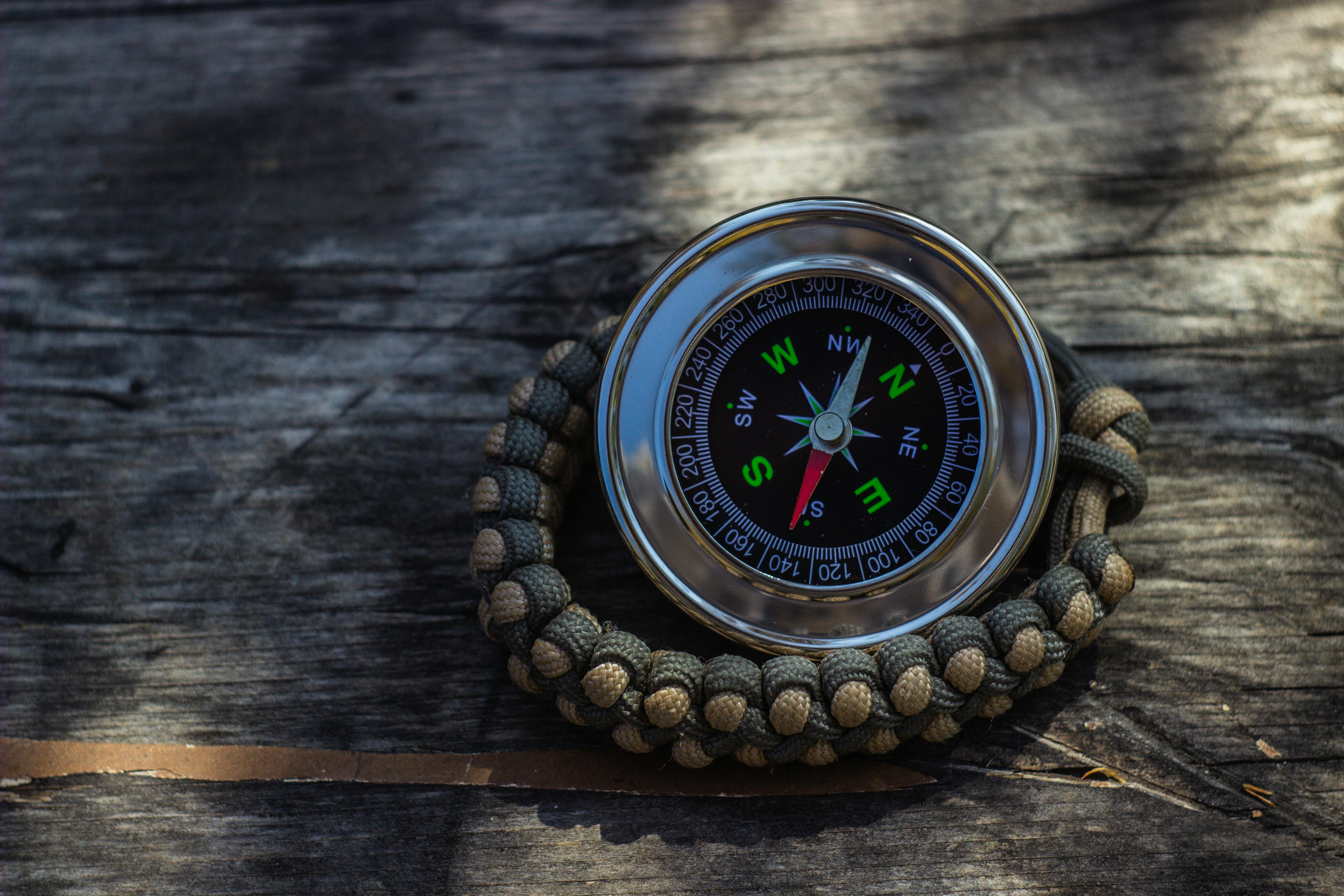 Silver and Black Round Compass on a Thread Bracelet · Free Stock Photo