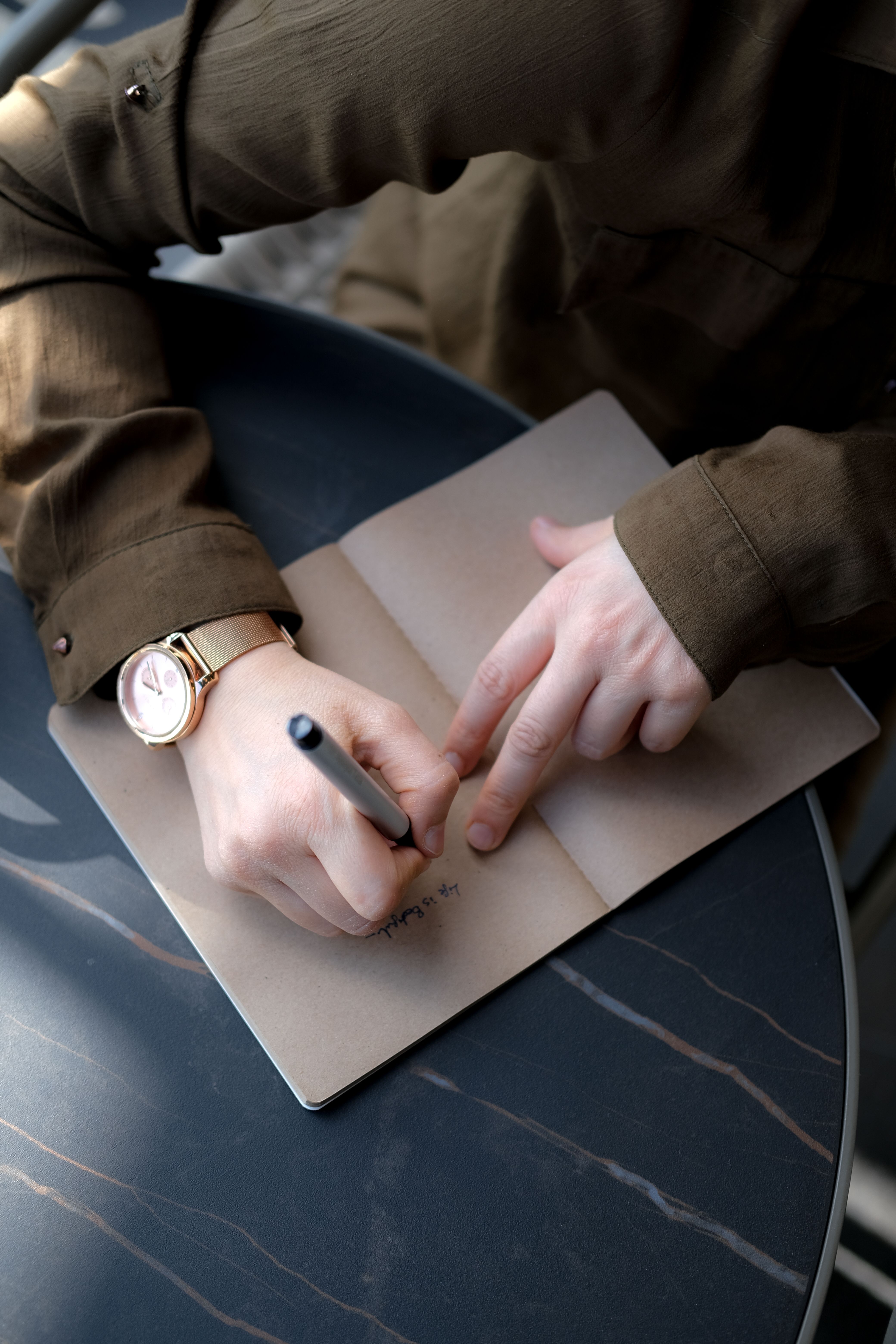 Person Writing on White Paper · Free Stock Photo