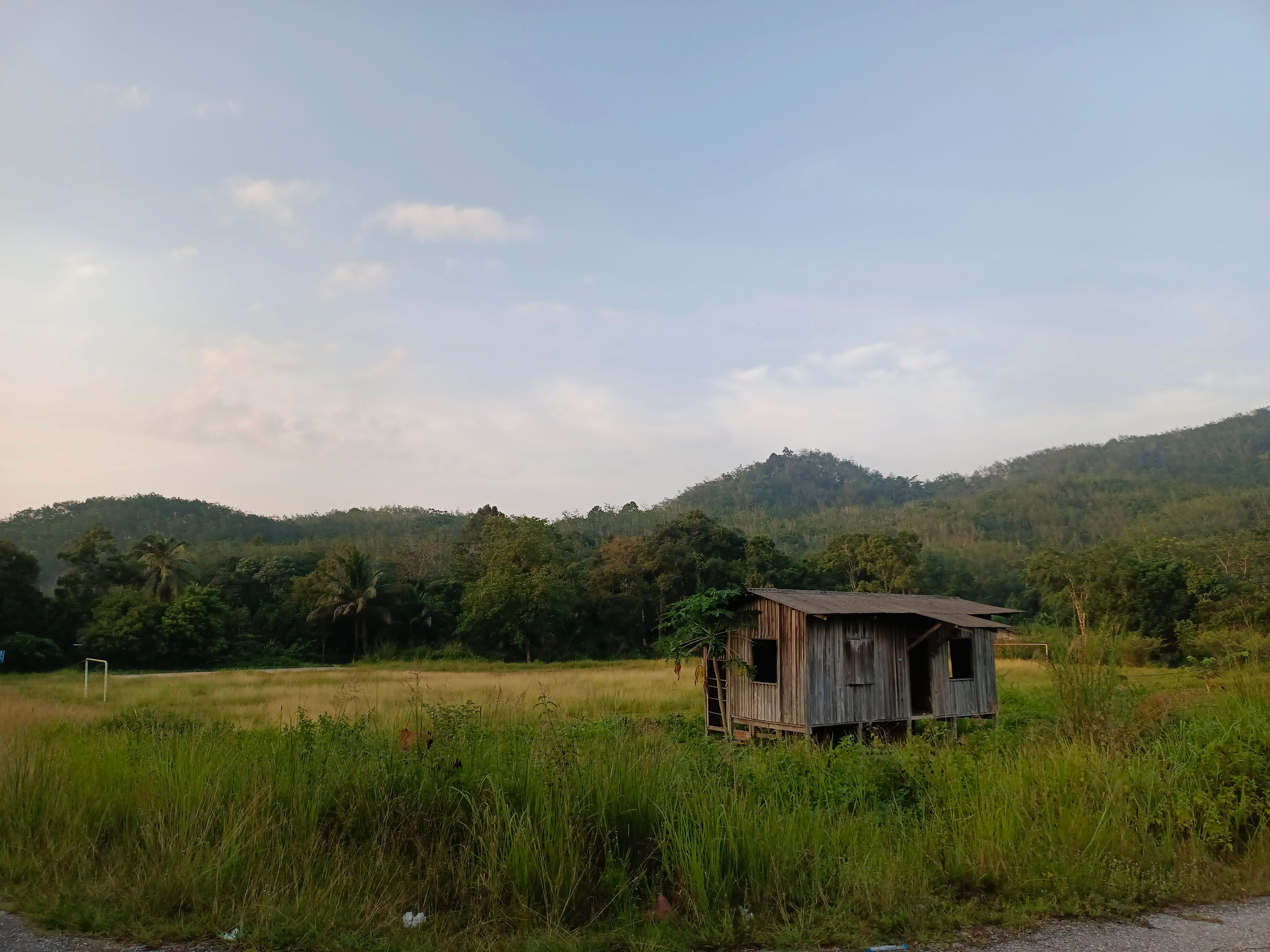 Wooden House on Grass Field under the Sky · Free Stock Photo