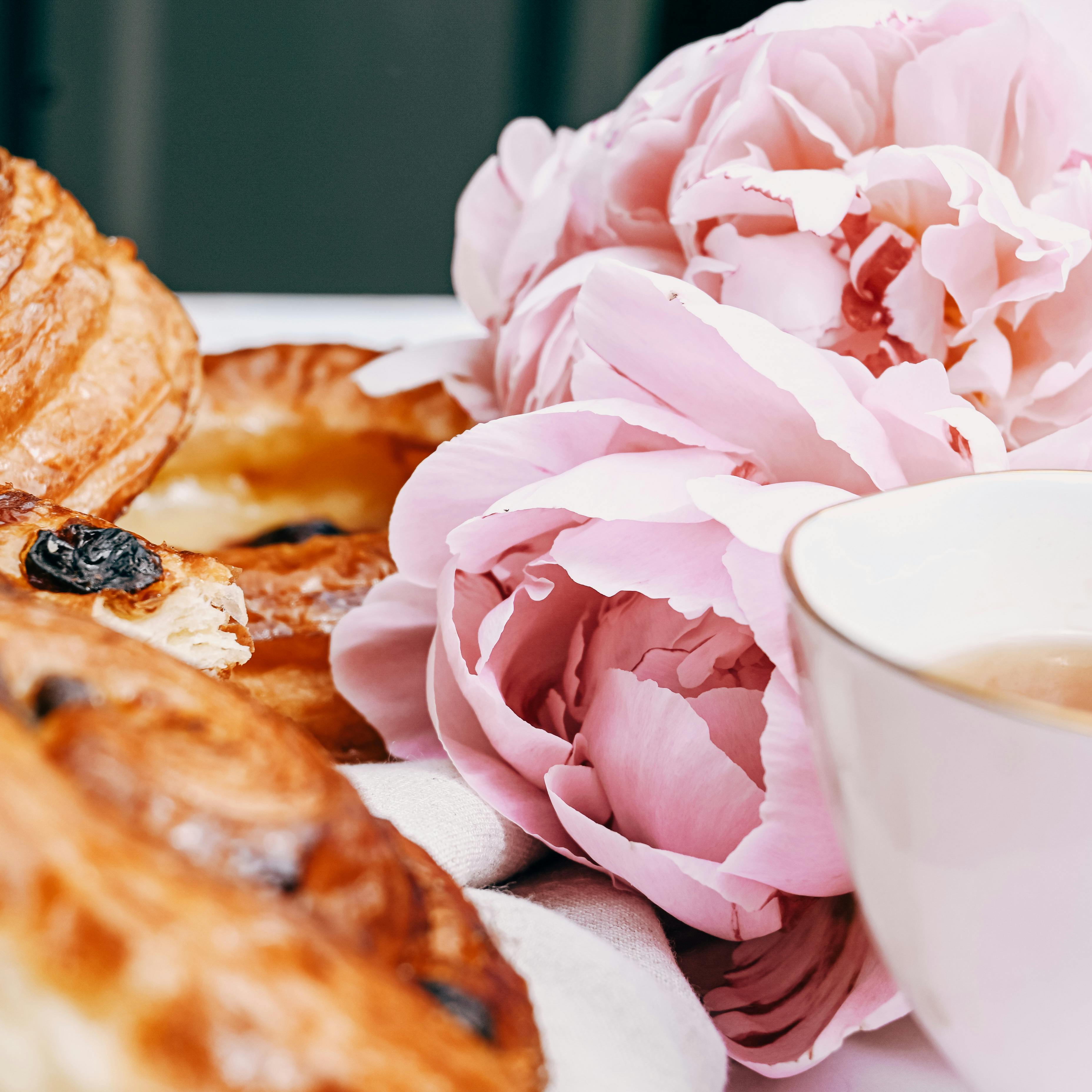 Flowers by Pastries with Raisins · Free Stock Photo