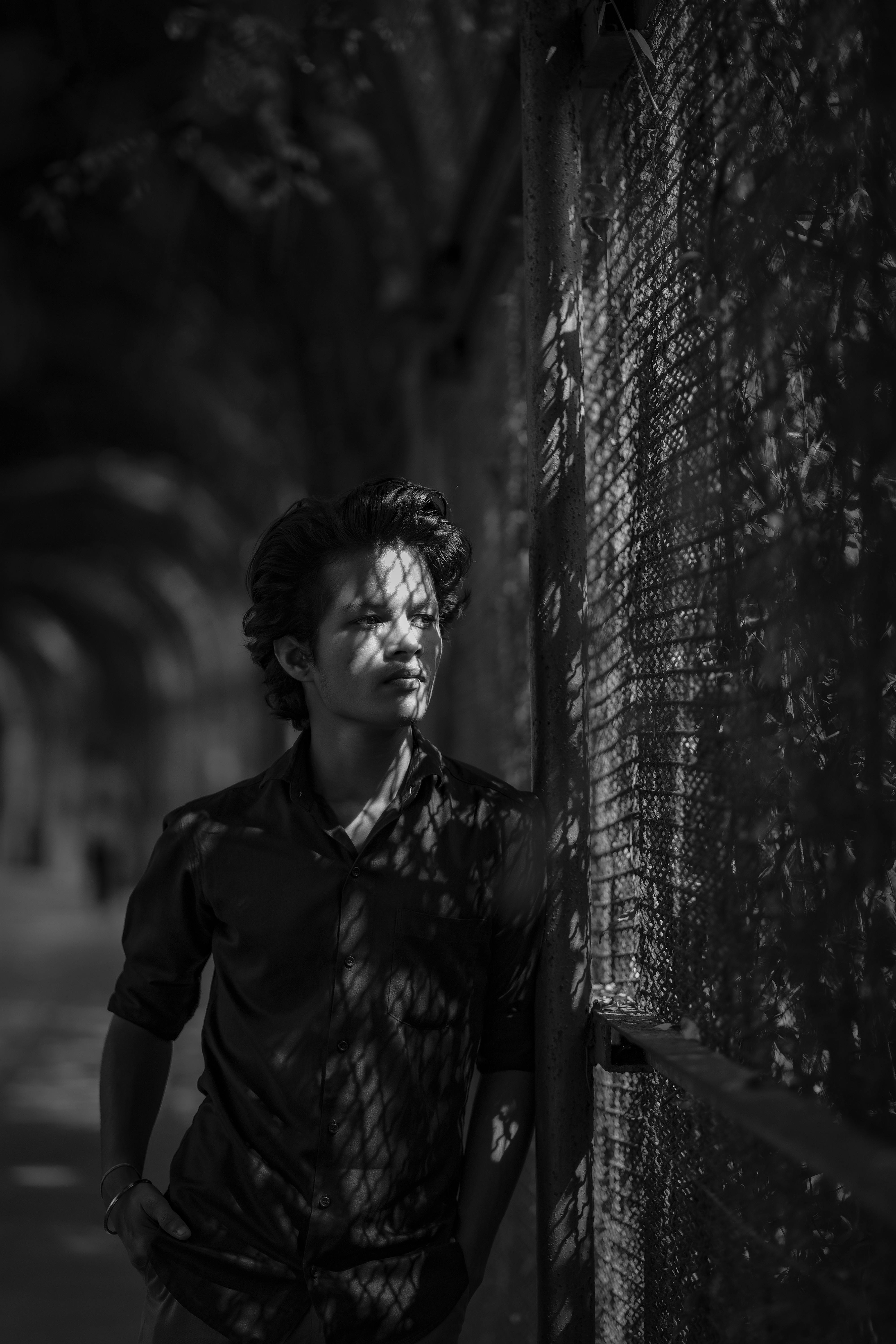 Man Leaning on Fence · Free Stock Photo