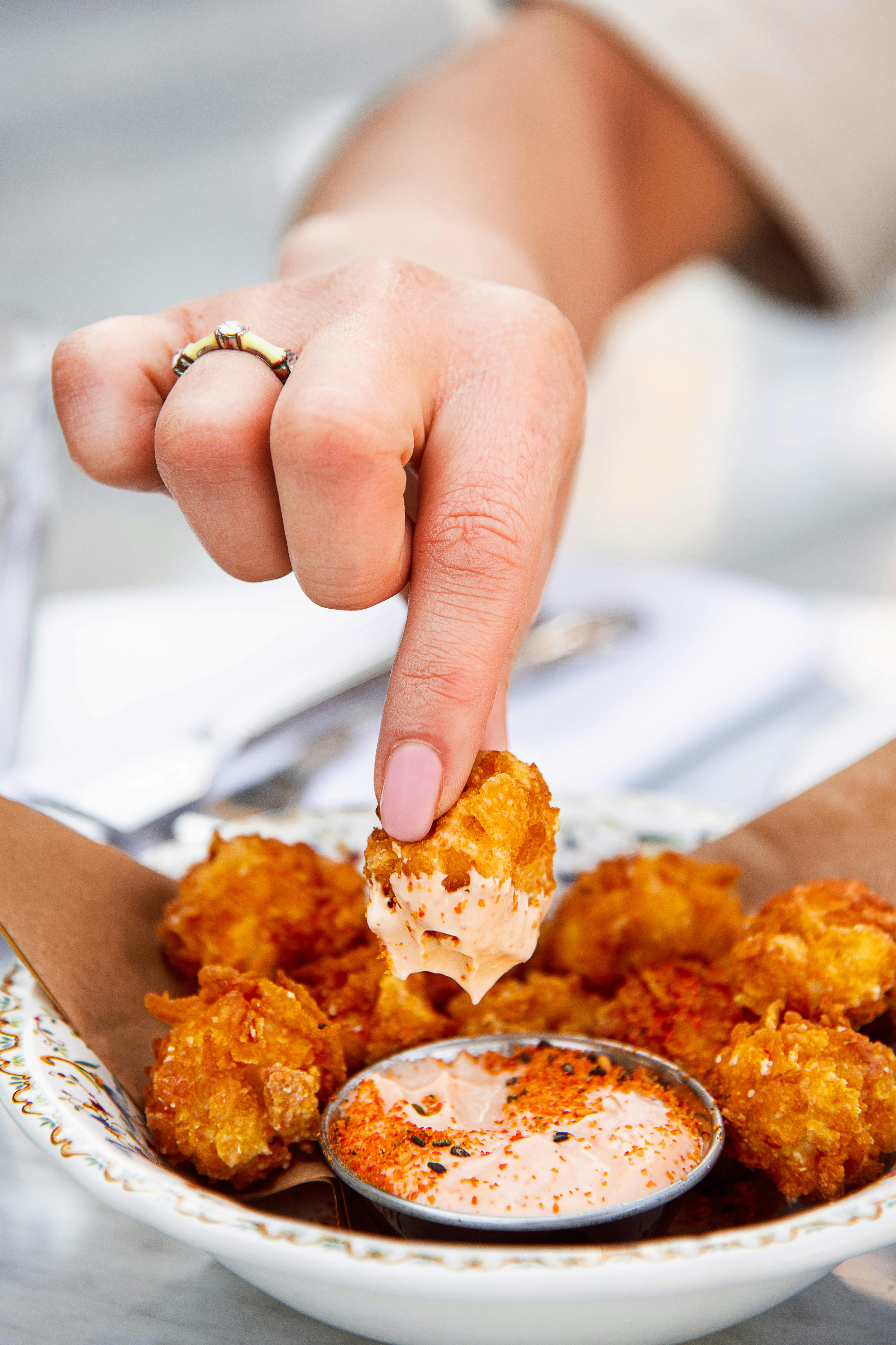 Dipping Fried Food in Sauce · Free Stock Photo