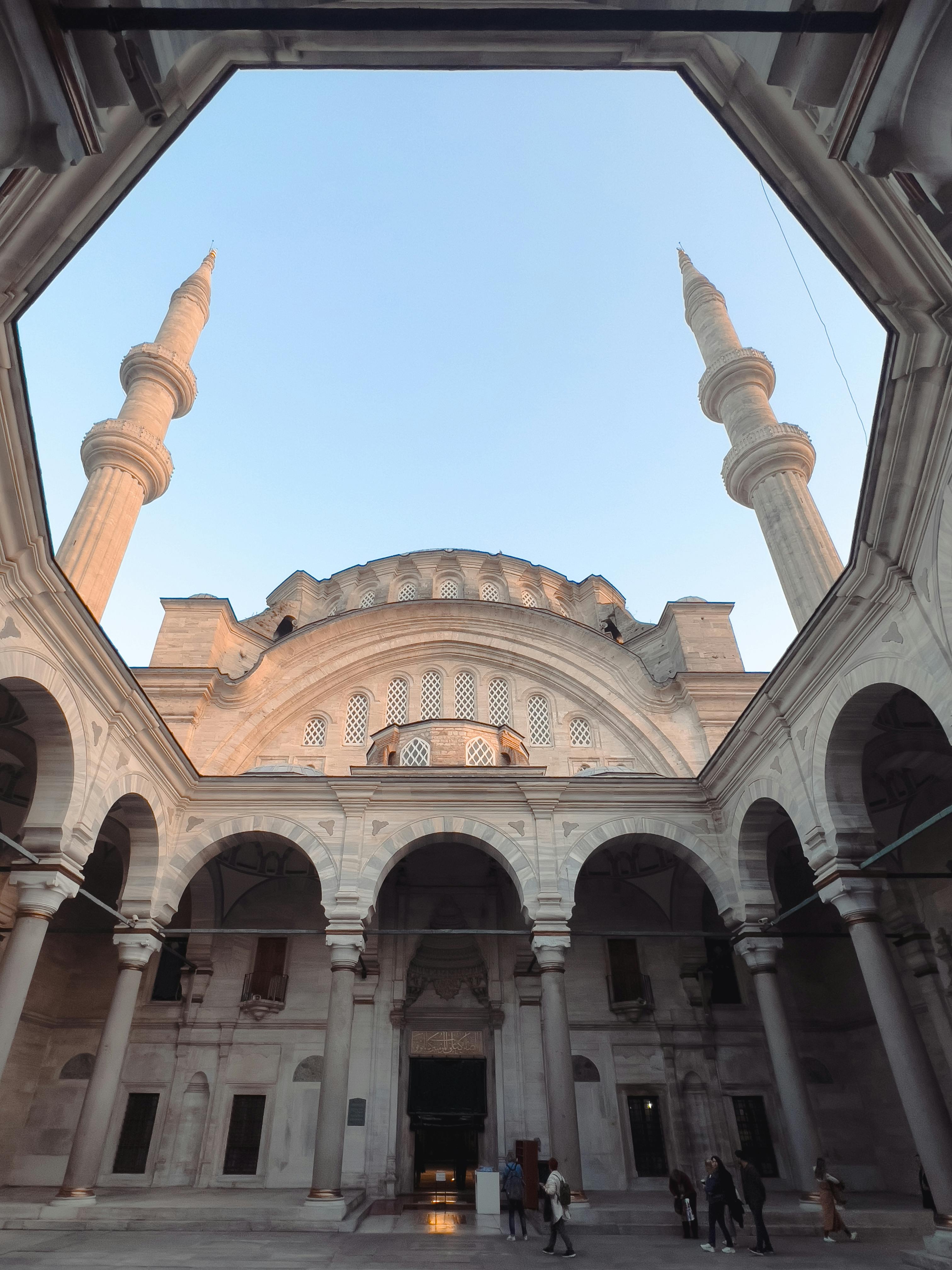 Courtyard and arched passage of medieval mosque · Free Stock Photo