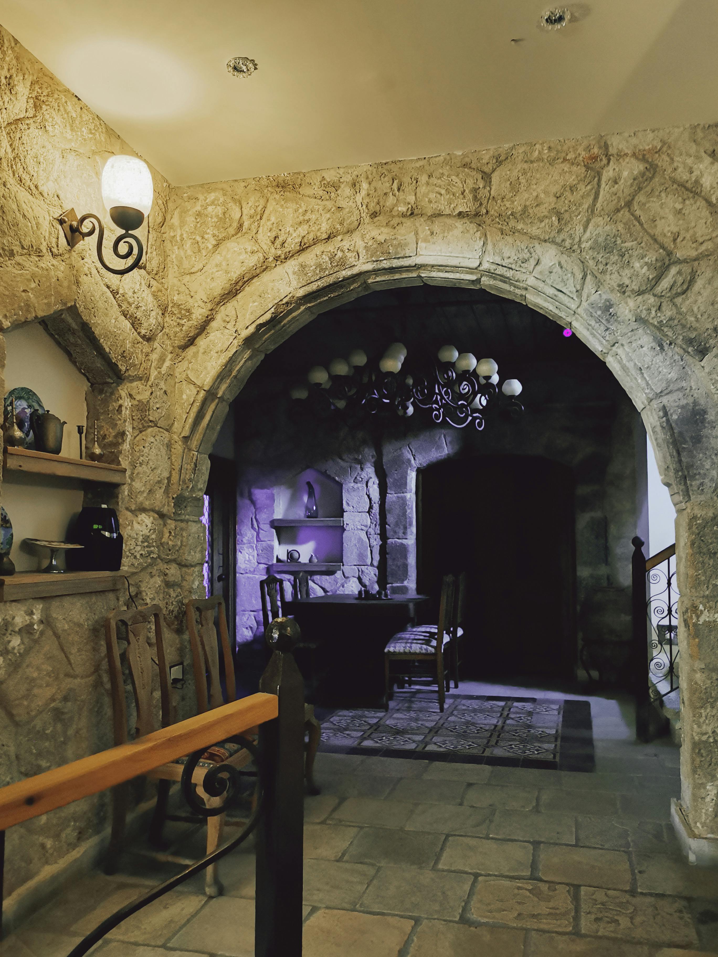 Photo of a Cellar with Stone Walls and a Chandelier · Free Stock Photo