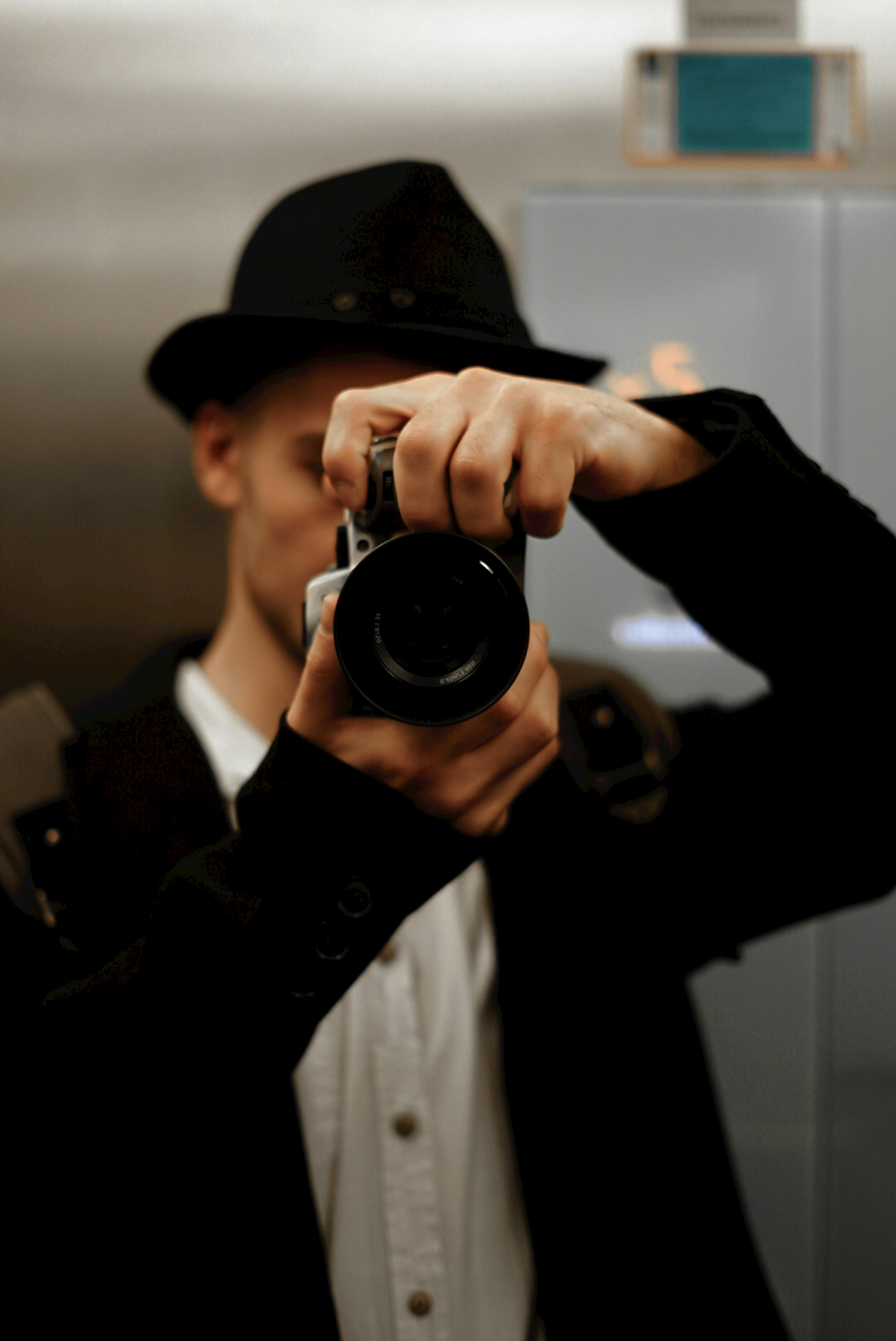 A Man in Black Suit Holding Camera · Free Stock Photo