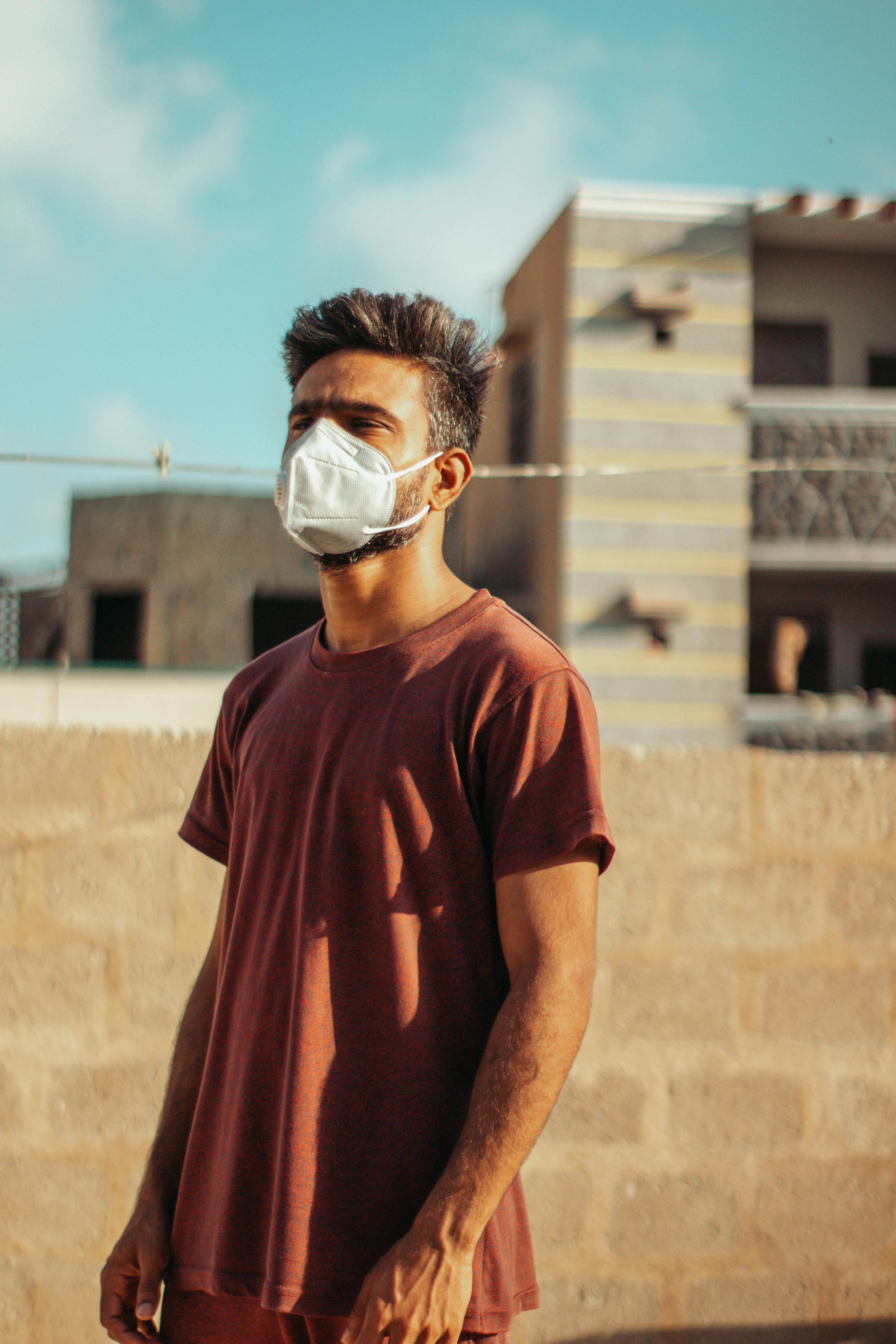 A Man in Brown Shirt Wearing Face Mask · Free Stock Photo