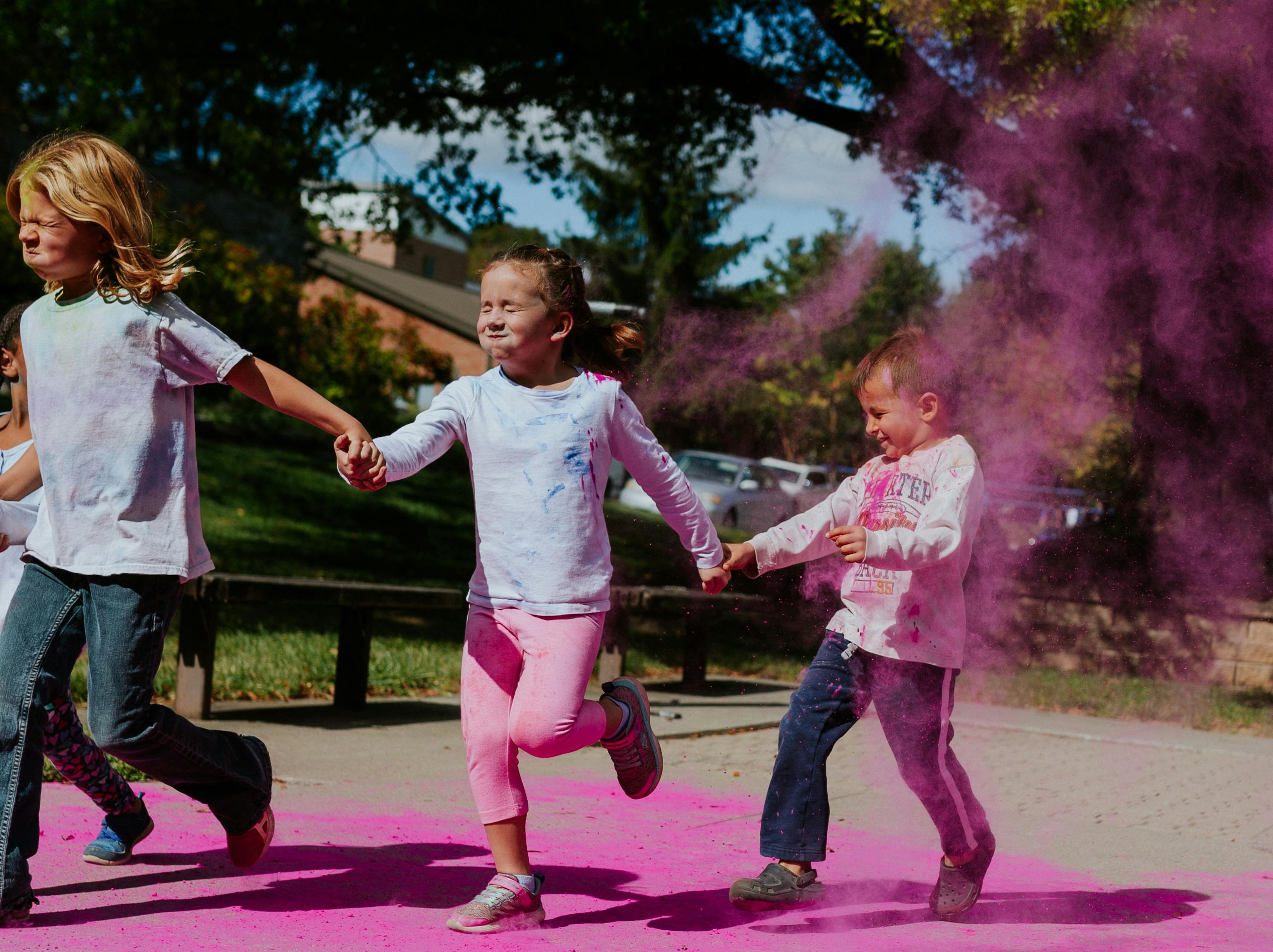 Children Holding Hands and Playing with Purple Smoke · Free Stock Photo