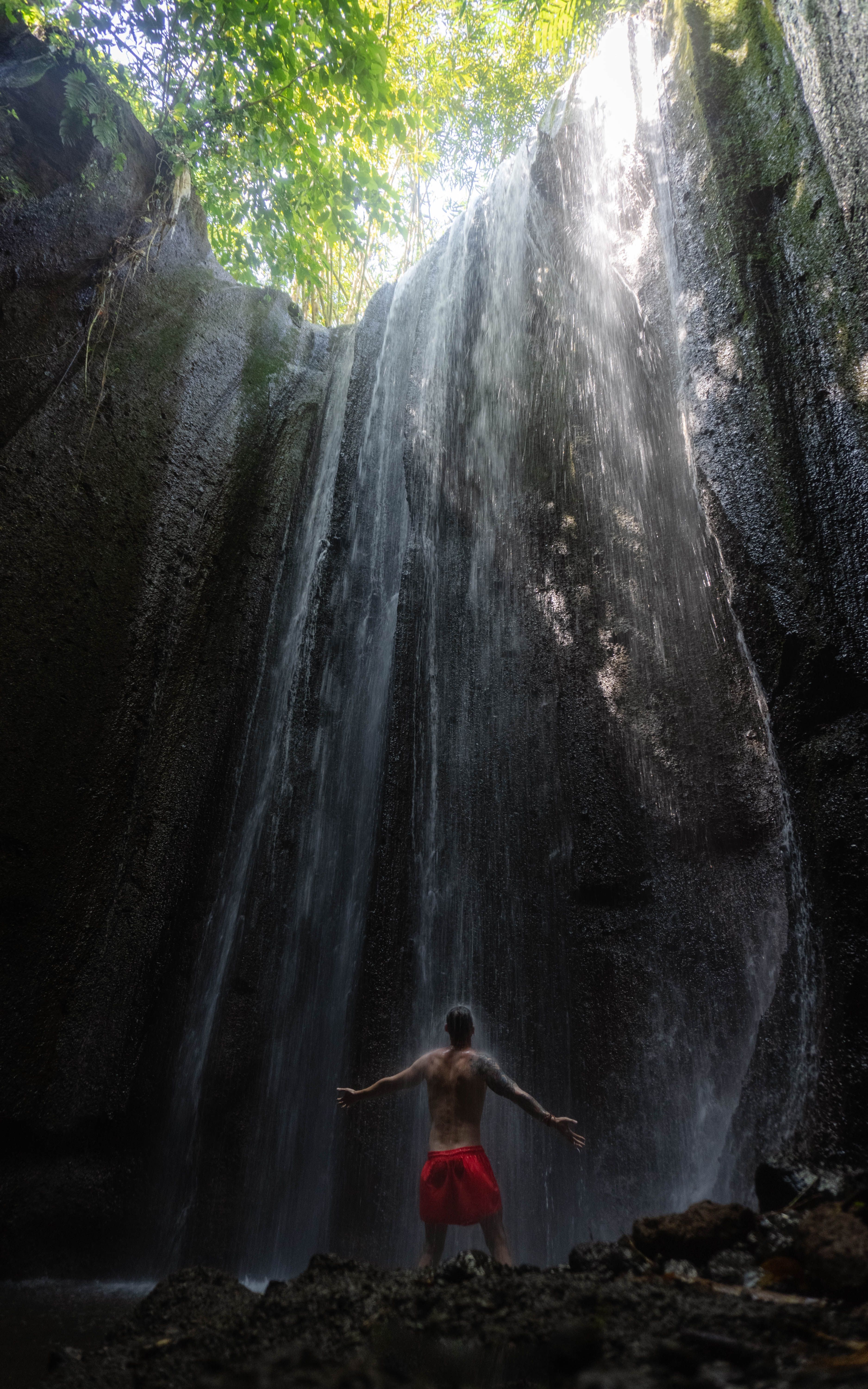Man Sitting Near Waterfalls · Free Stock Photo