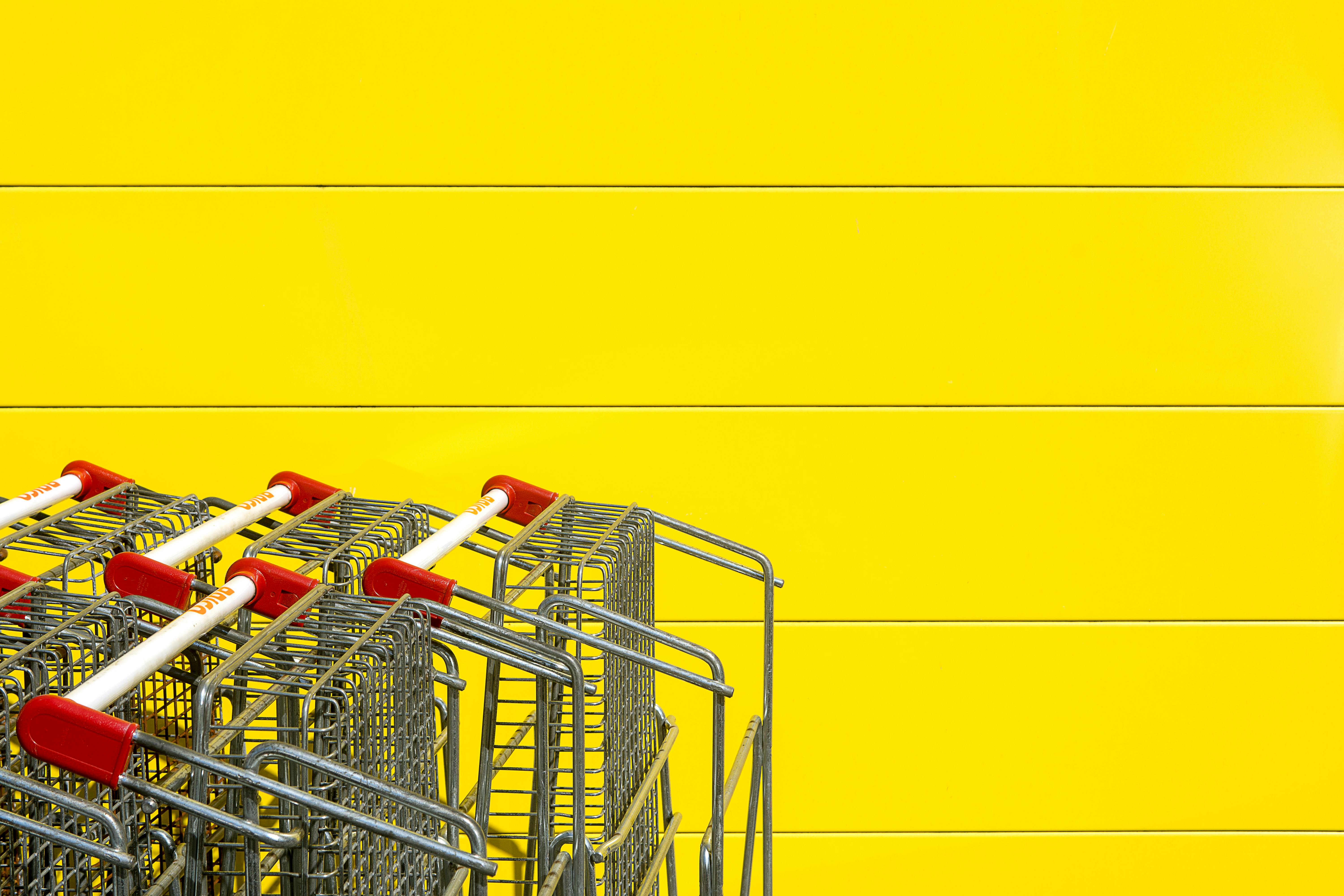 Shopping Carts on Yellow Background · Free Stock Photo