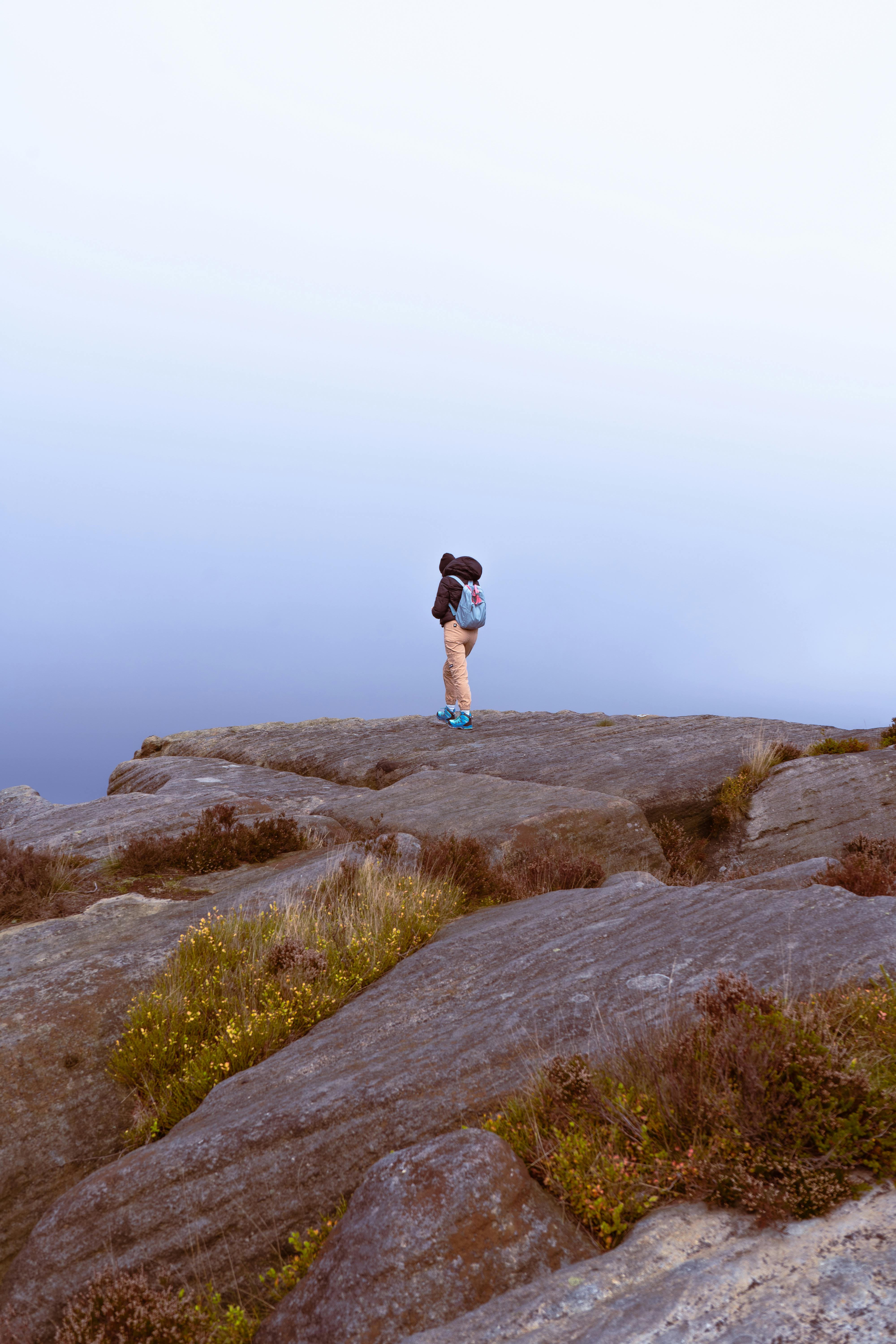 Person Standing on Rocks · Free Stock Photo