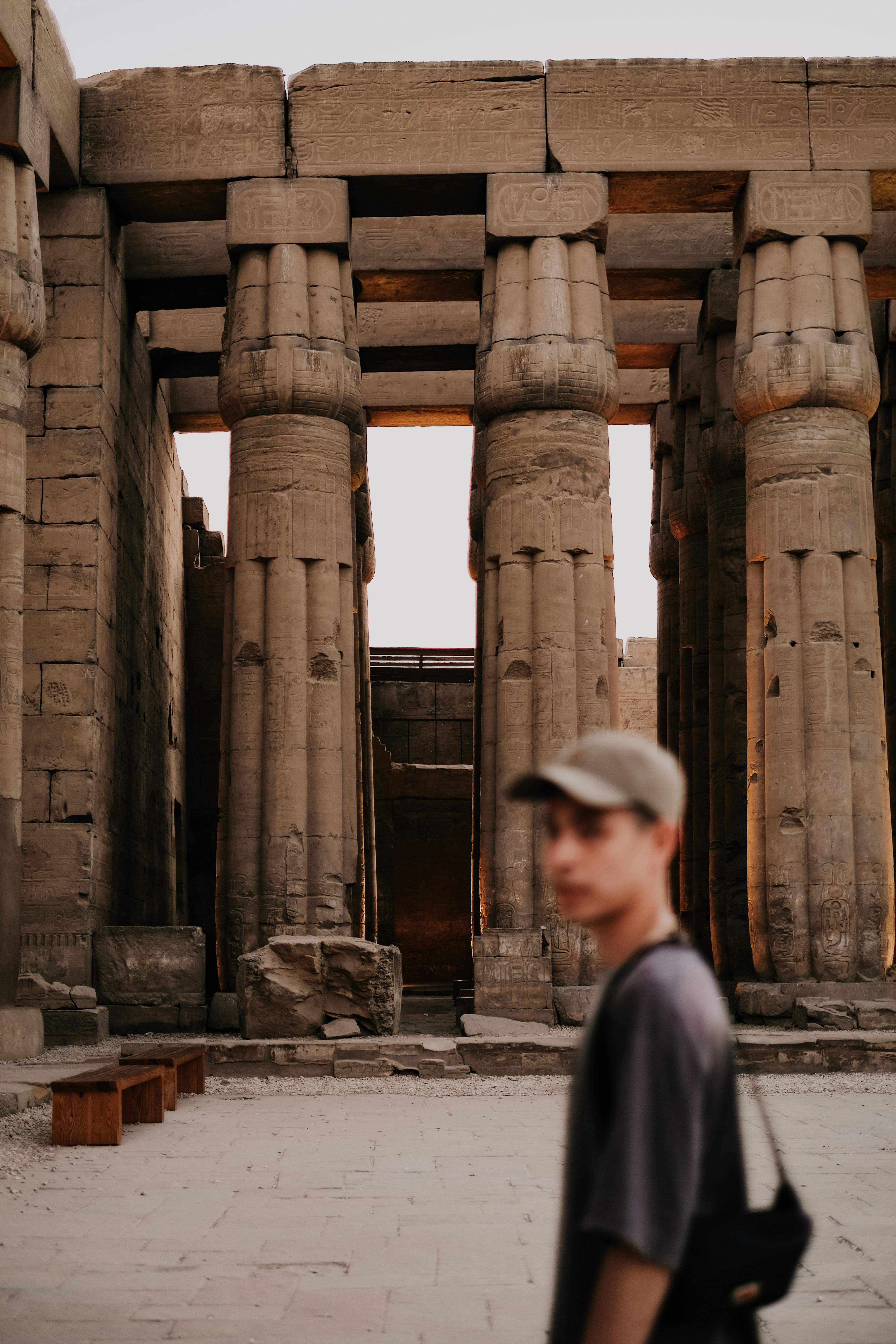 A Man in Striped Shirt Serving as Tour Guide · Free Stock Photo
