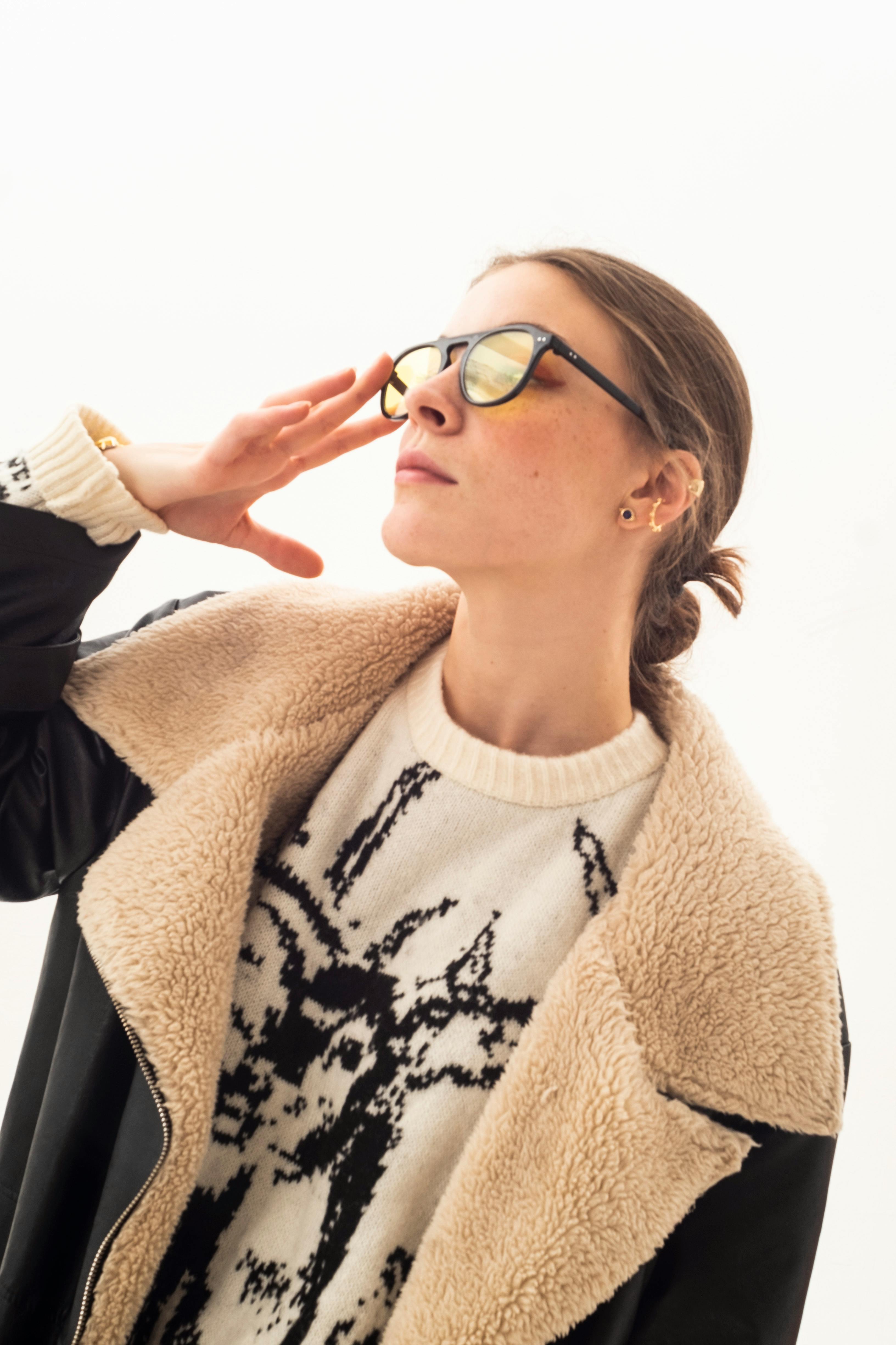 Woman Posing by White Building Wall · Free Stock Photo