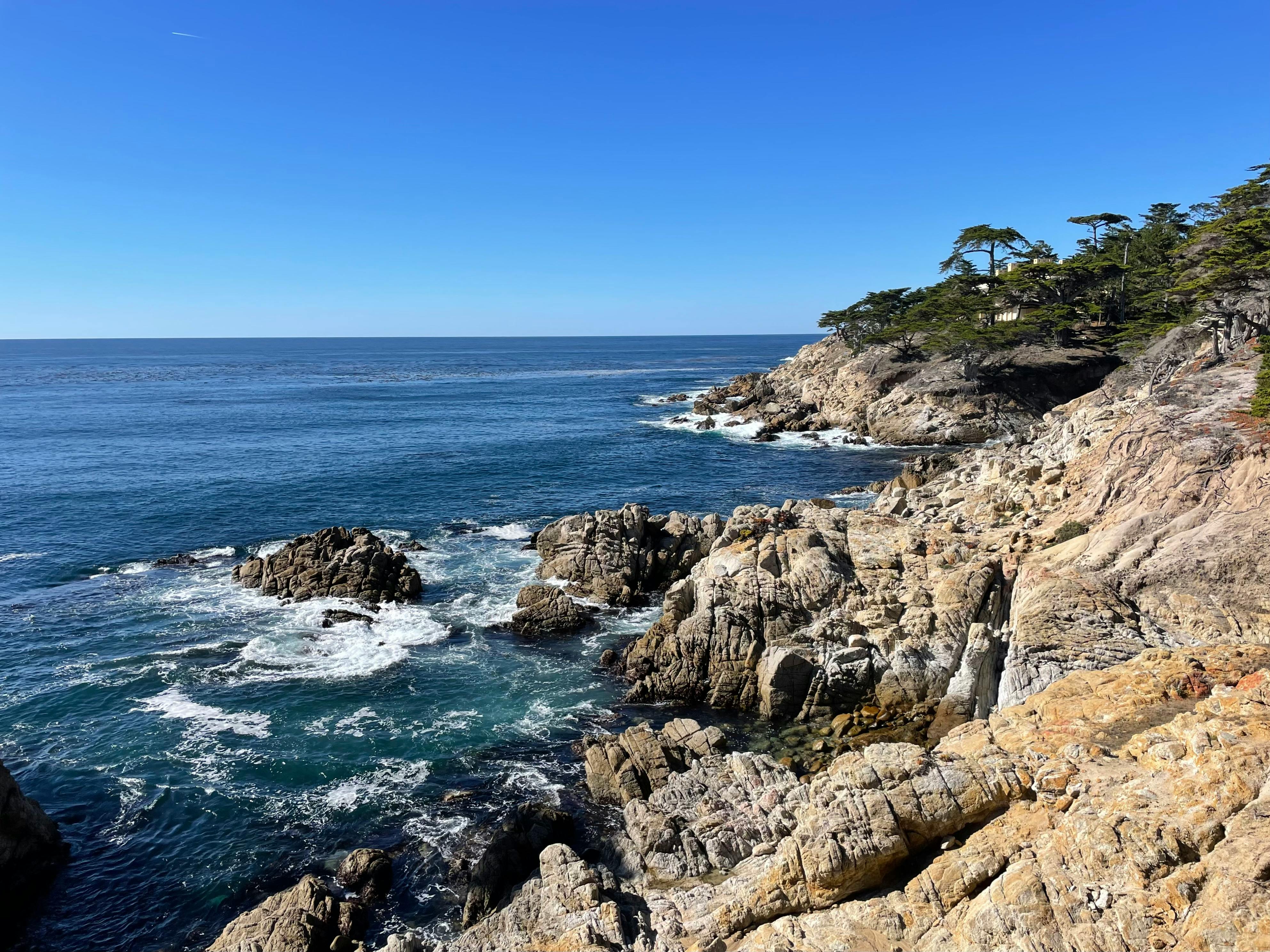 Gray Rocky Cliff Under Blue Sky · Free Stock Photo