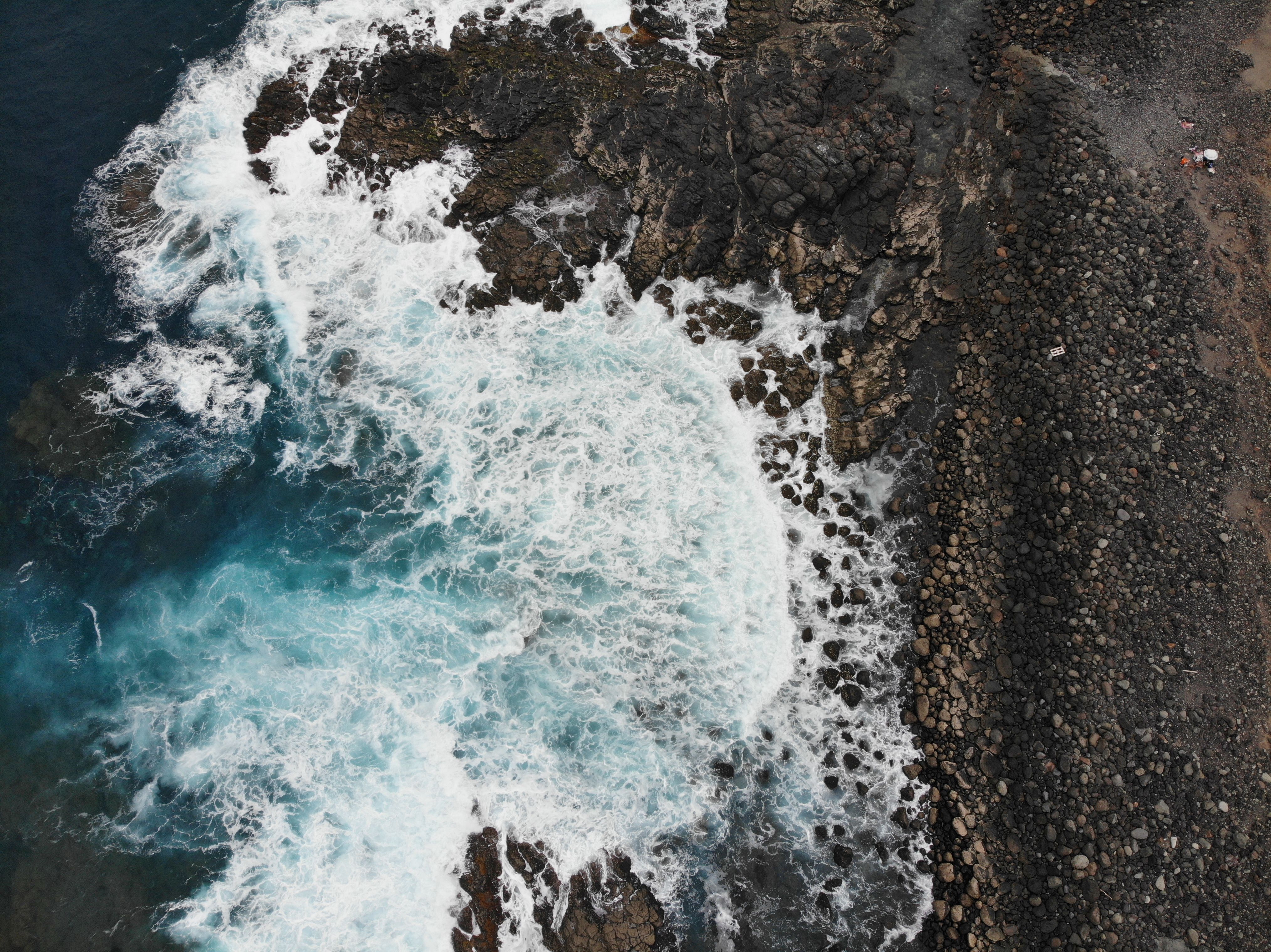Aerial Photography of a Rocky Shore · Free Stock Photo
