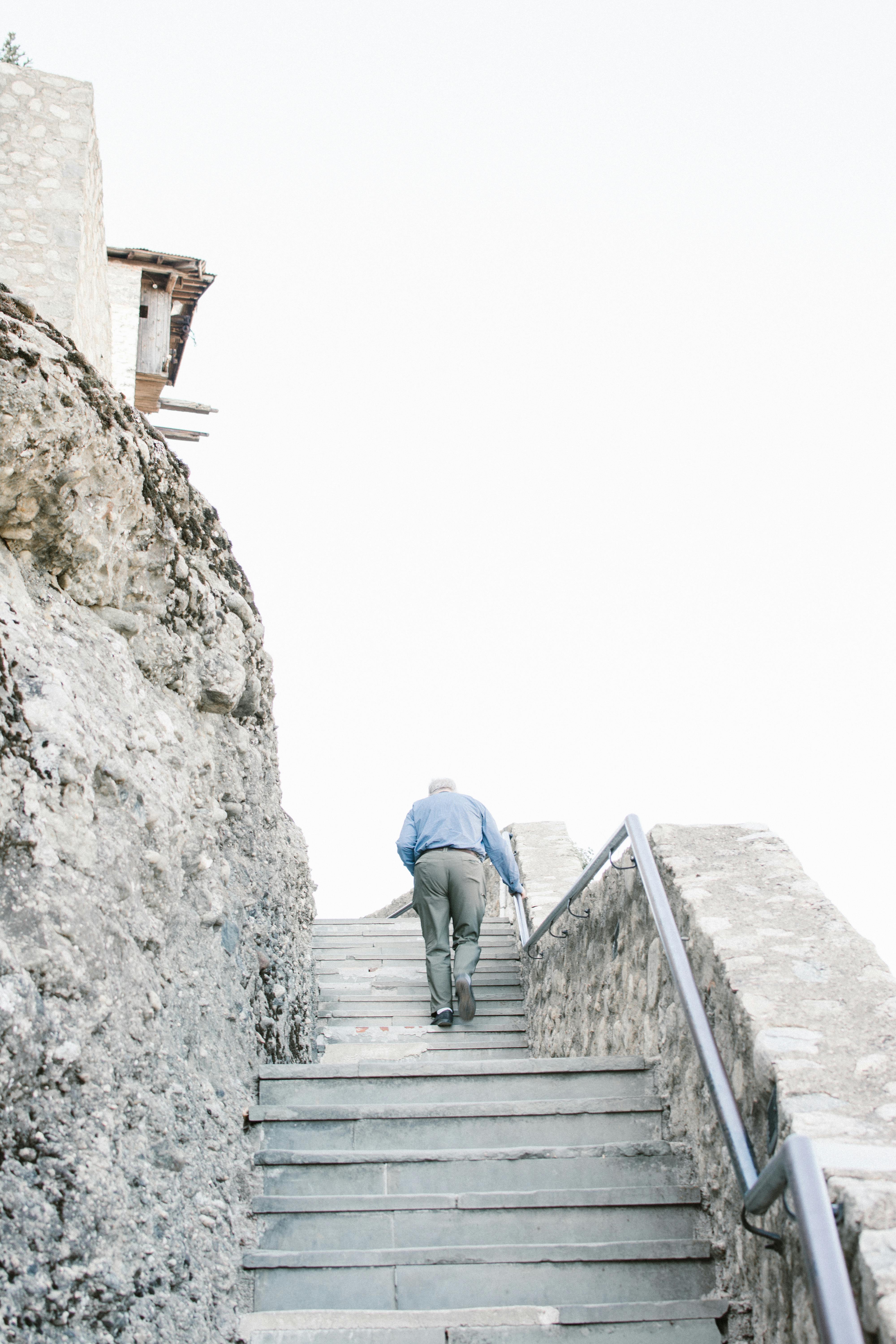 Person Going Up the Stairs · Free Stock Photo