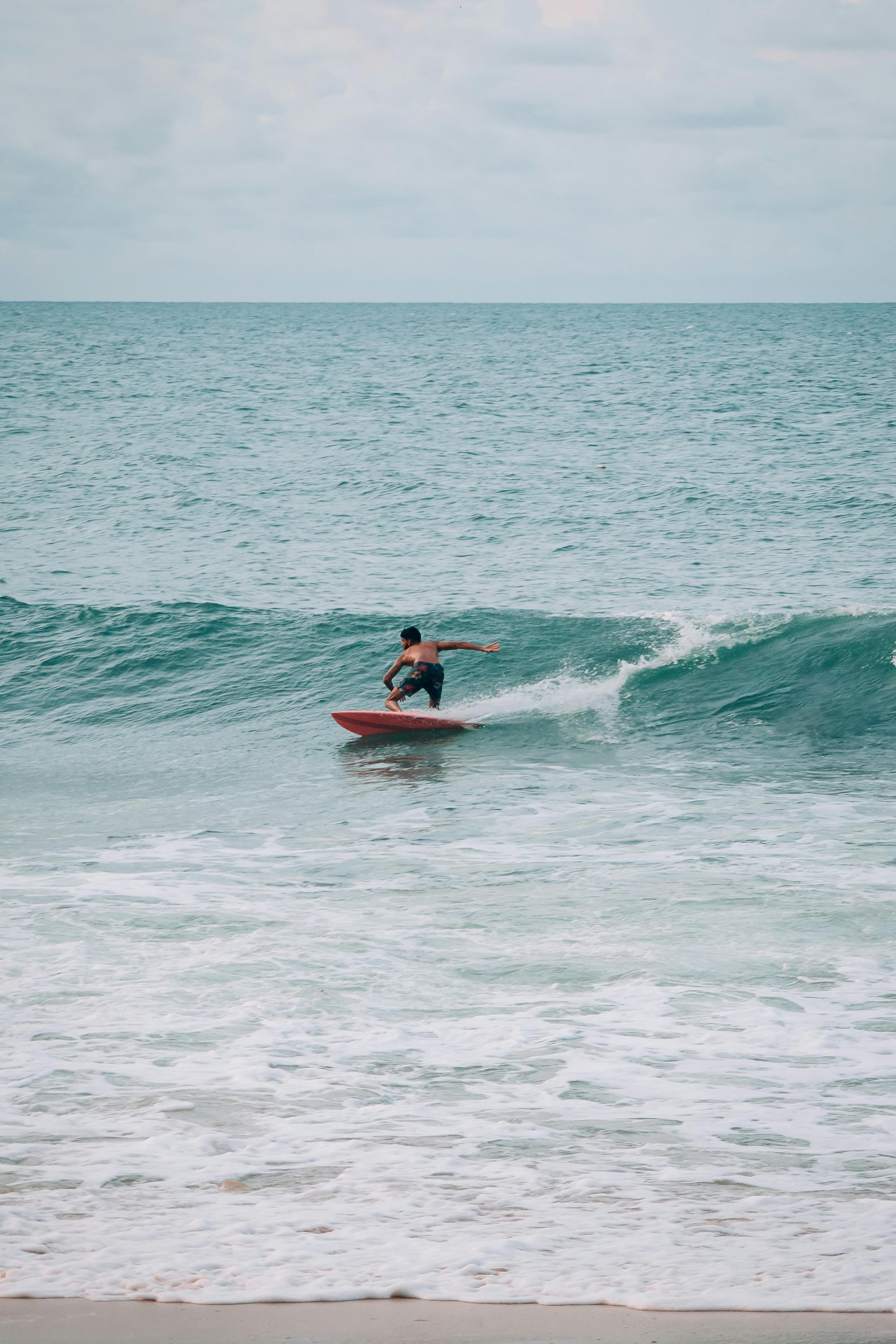 Shirtless Man Surfing Sea Wave · Free Stock Photo