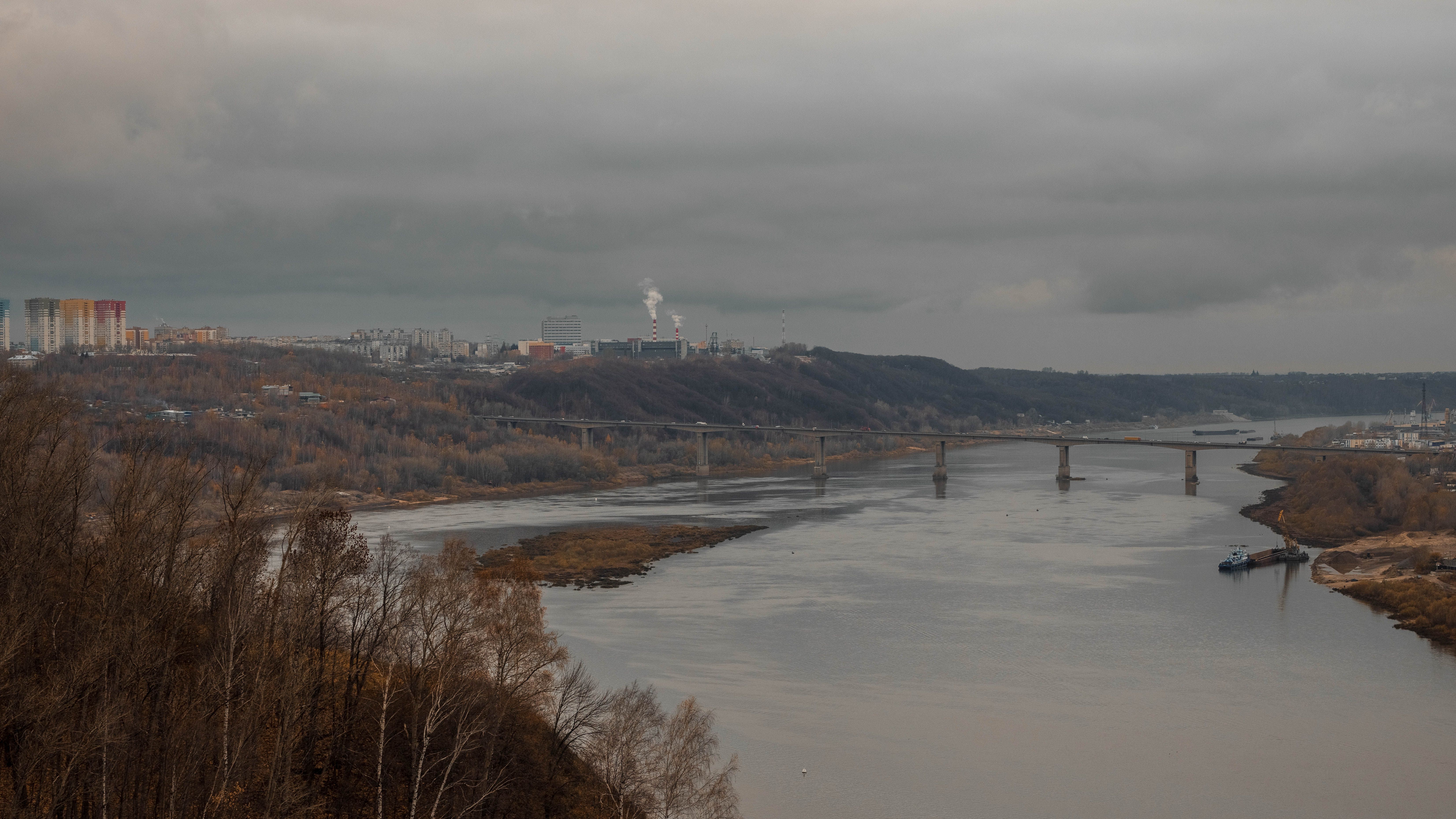 Bridge Over a River Under a Cloudy Sky · Free Stock Photo