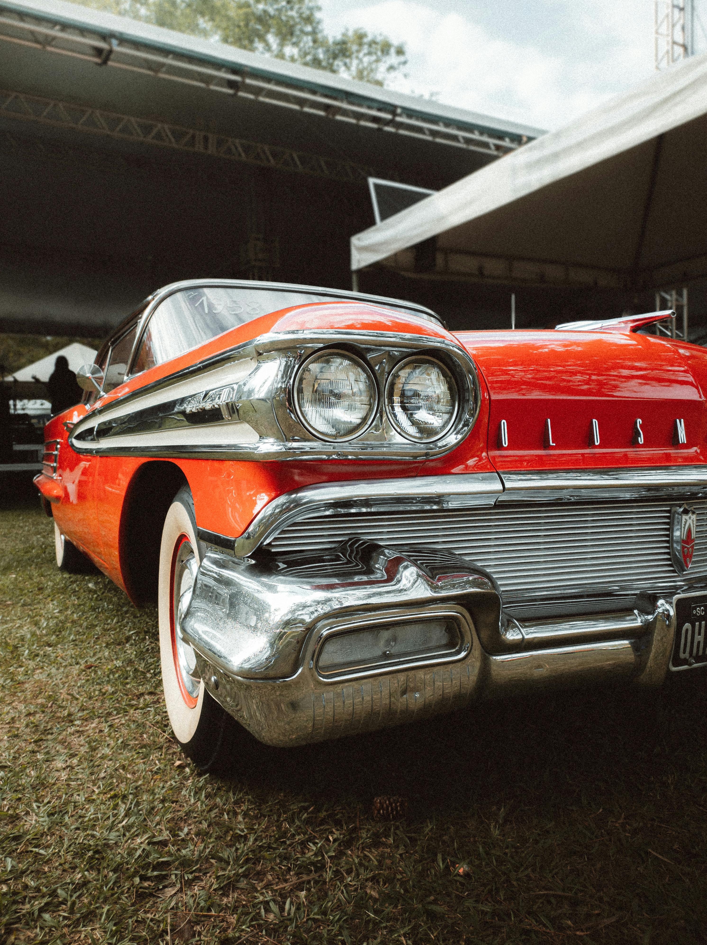 Photo of a Red and Silver Vintage Car · Free Stock Photo