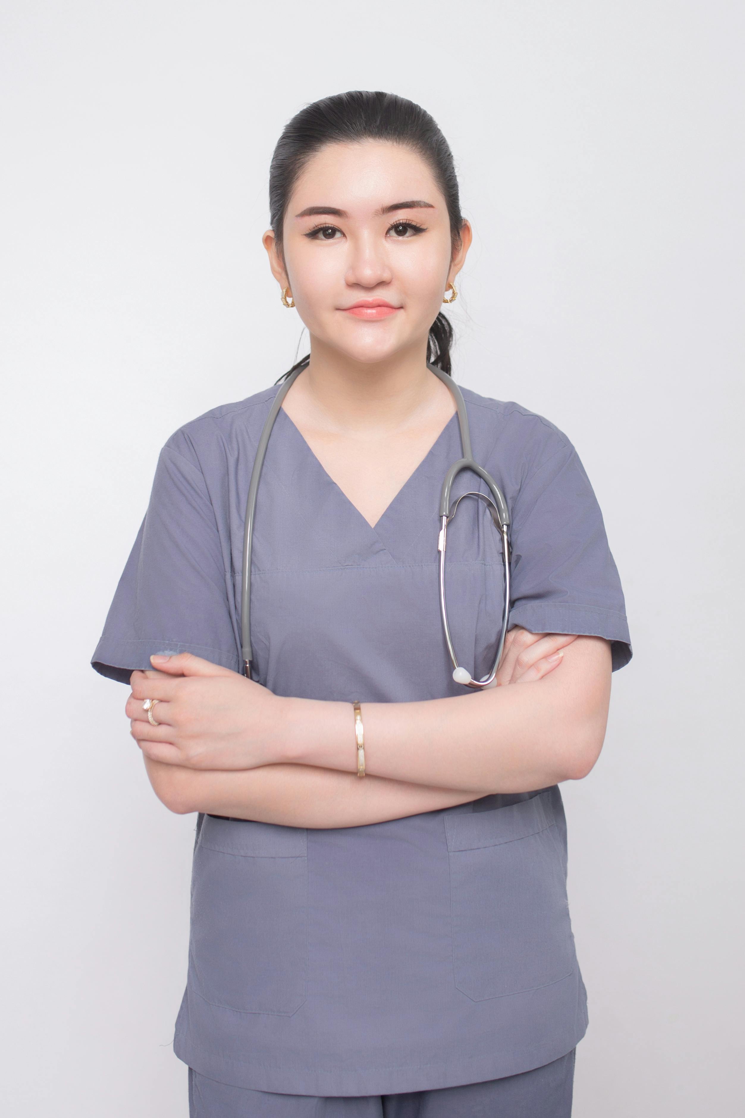 Portrait of a Doctor in a Medical Apron · Free Stock Photo