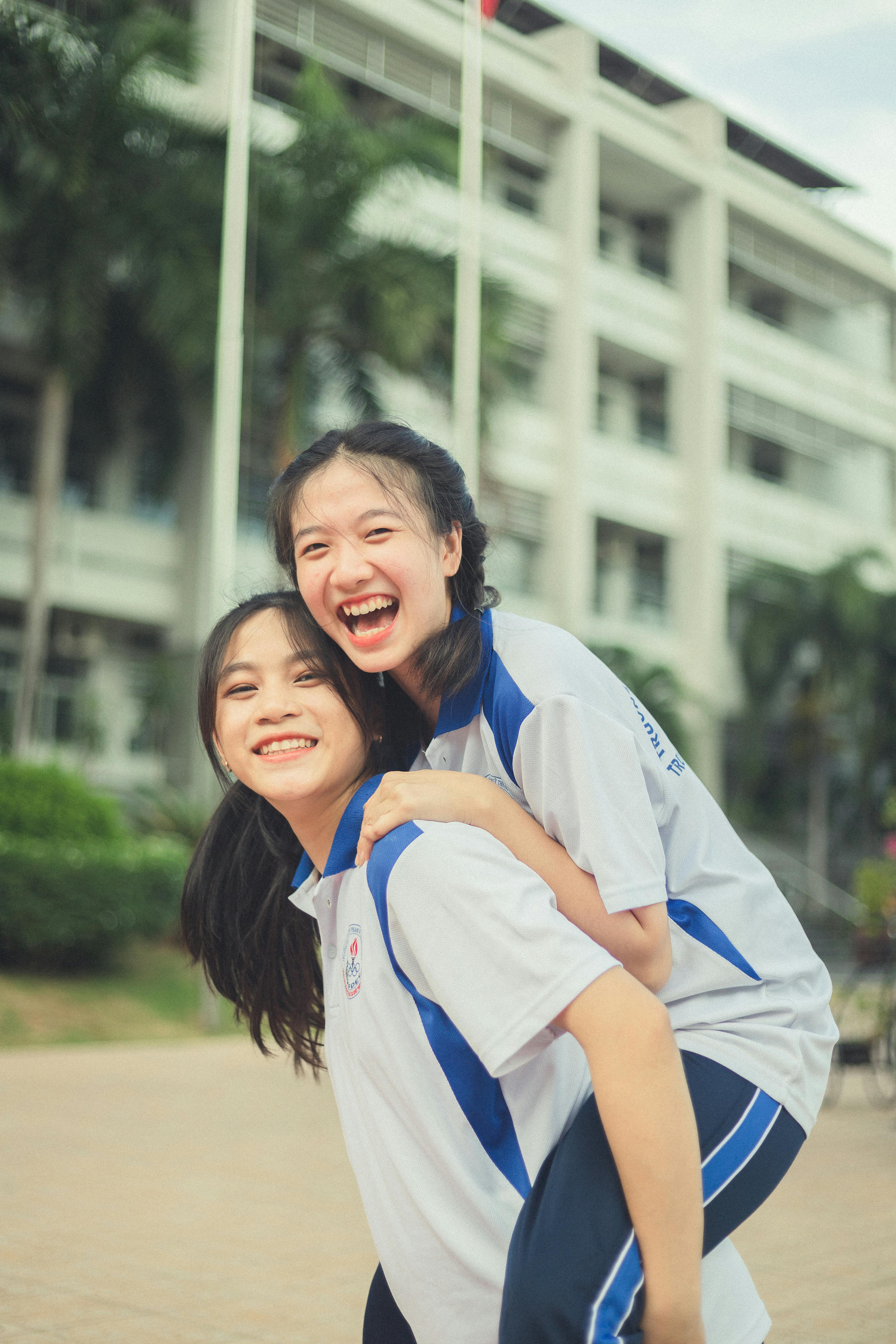 Woman Carrying a Friend on Her Back · Free Stock Photo