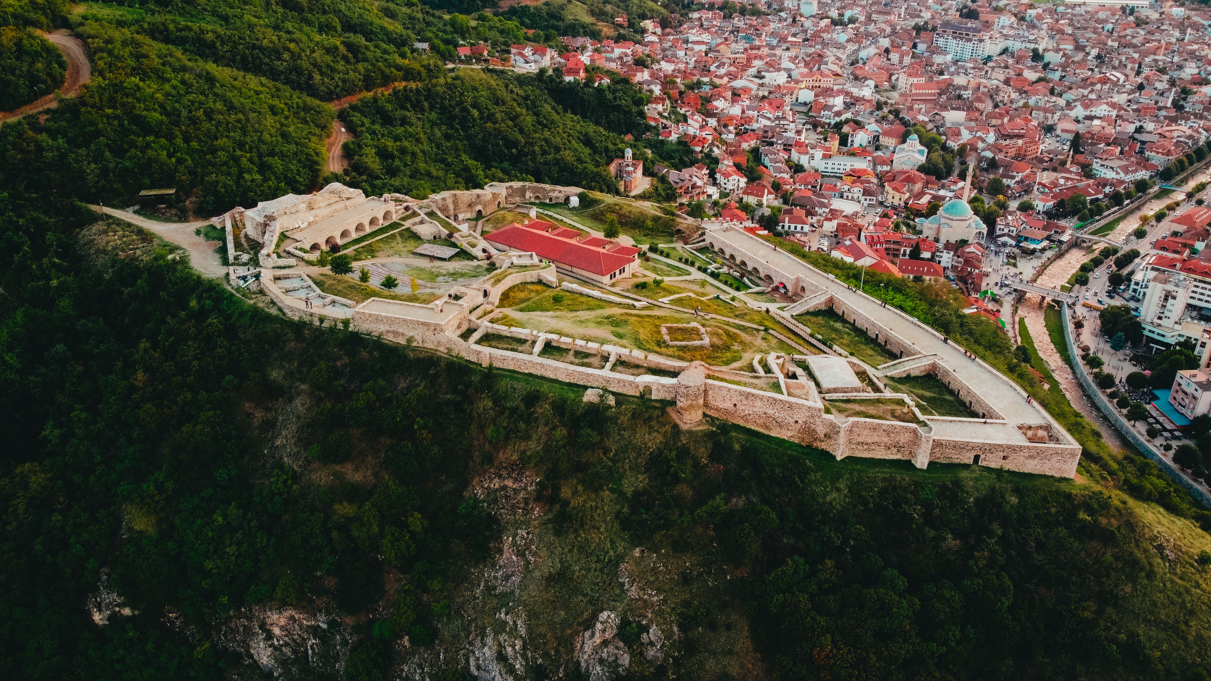Fortifications on Mountain Towering over City · Free Stock Photo