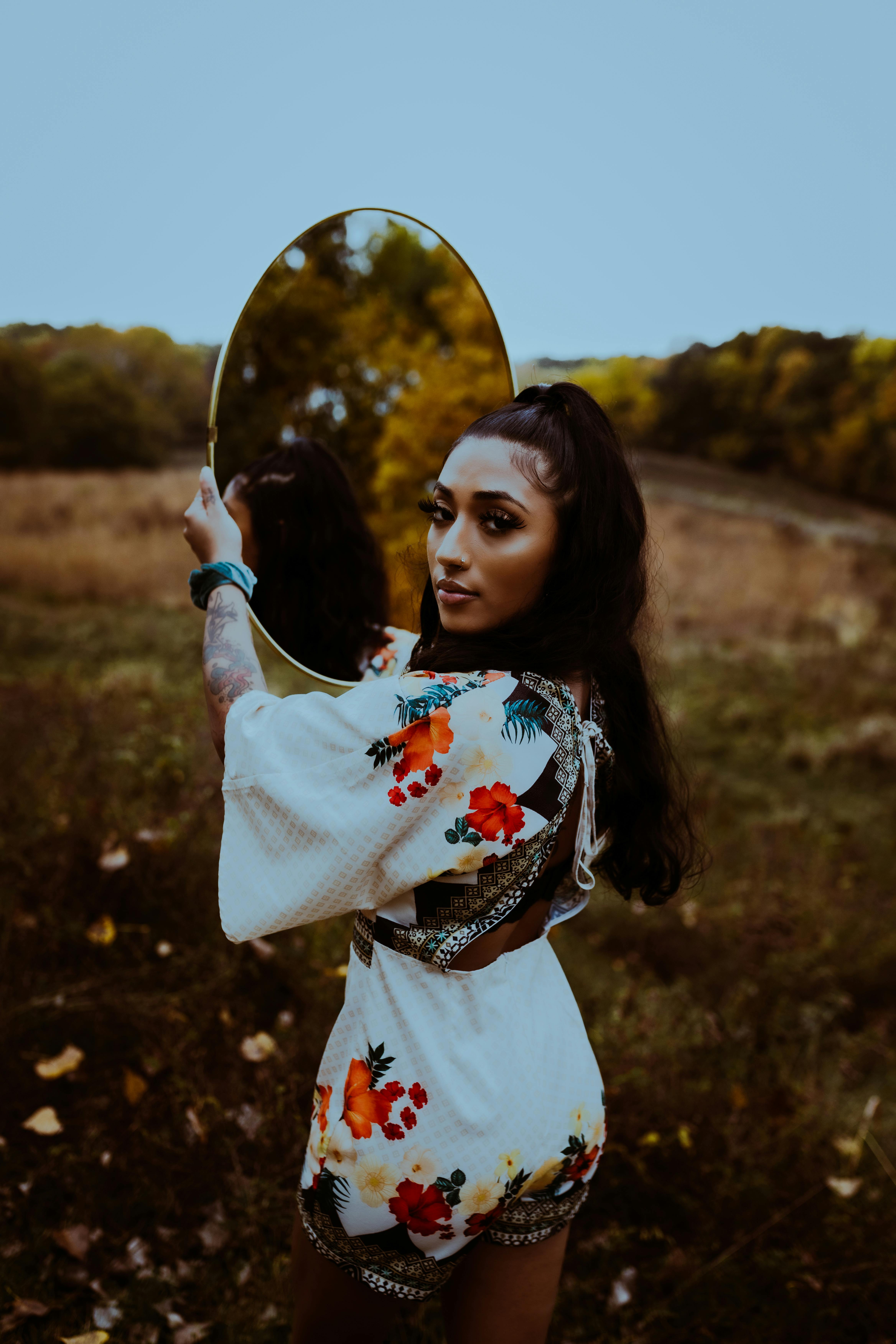 Two Girls Holding Round Mirrors · Free Stock Photo