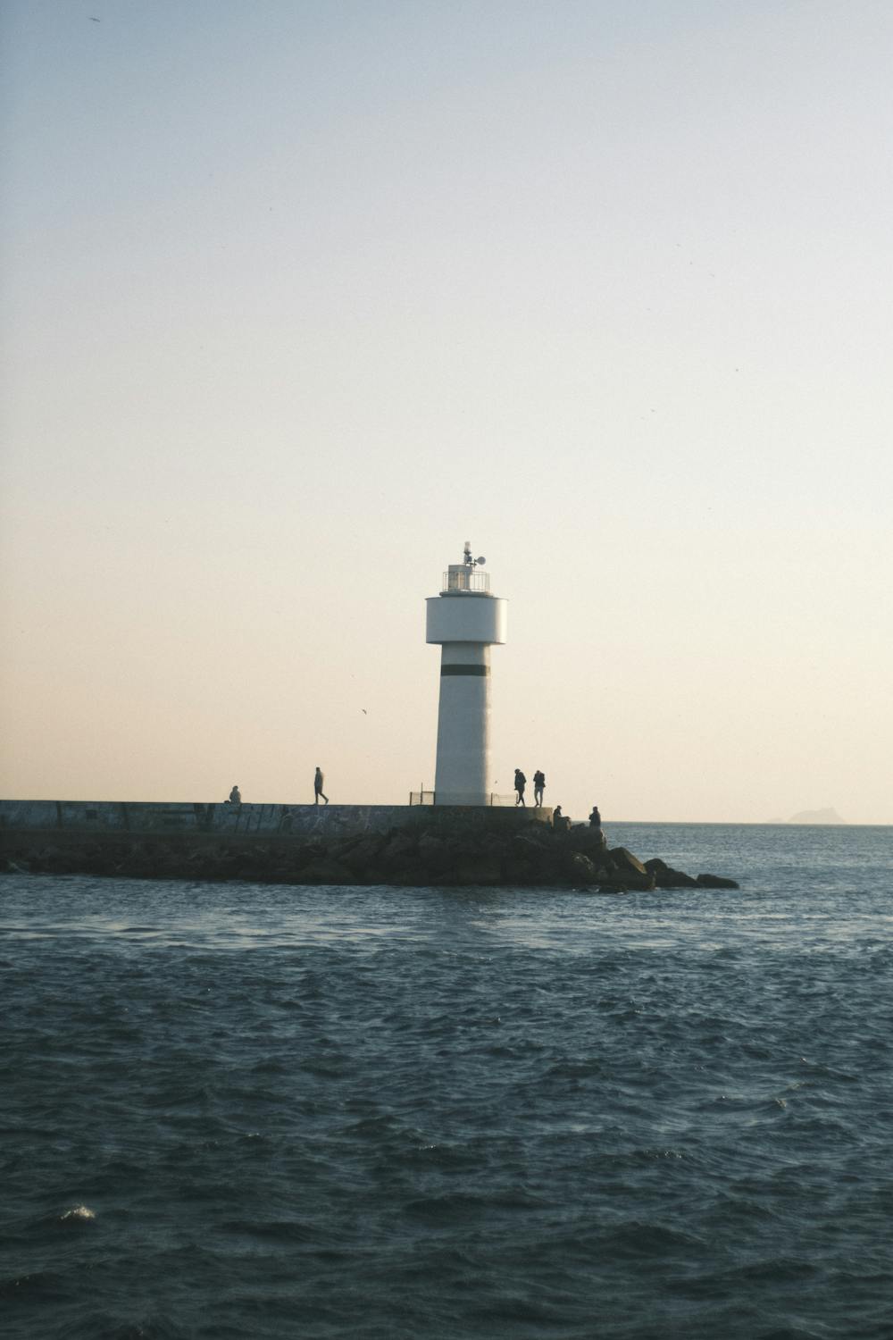 White Lighthouse Near the Sea · Free Stock Photo White Lighthouse Near the Sea · Free Stock Photo