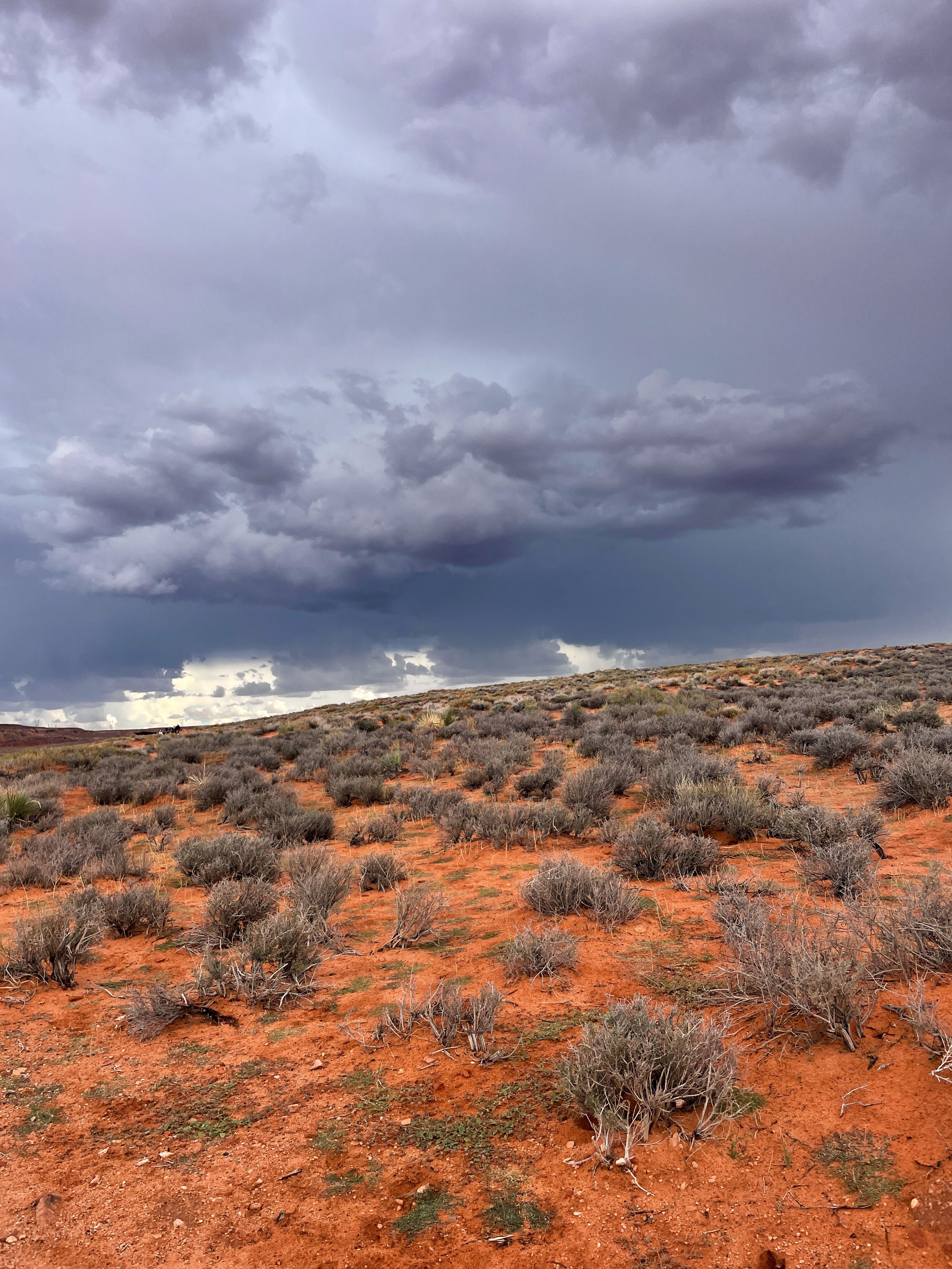 A Cloudy Sky over a Desert Landscape · Free Stock Photo