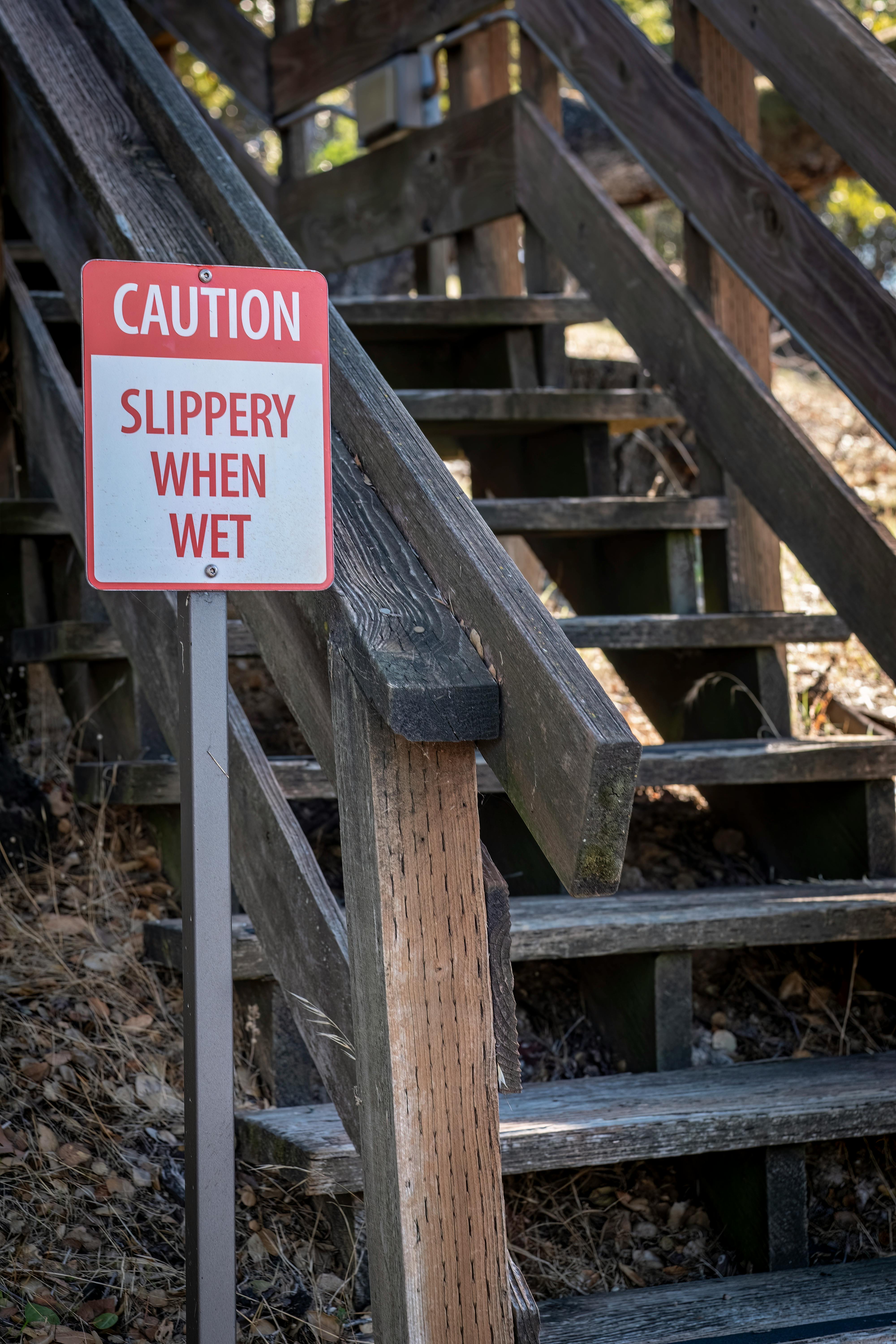 Sign in front of Wooden Steps Signaling Danger · Free Stock Photo
