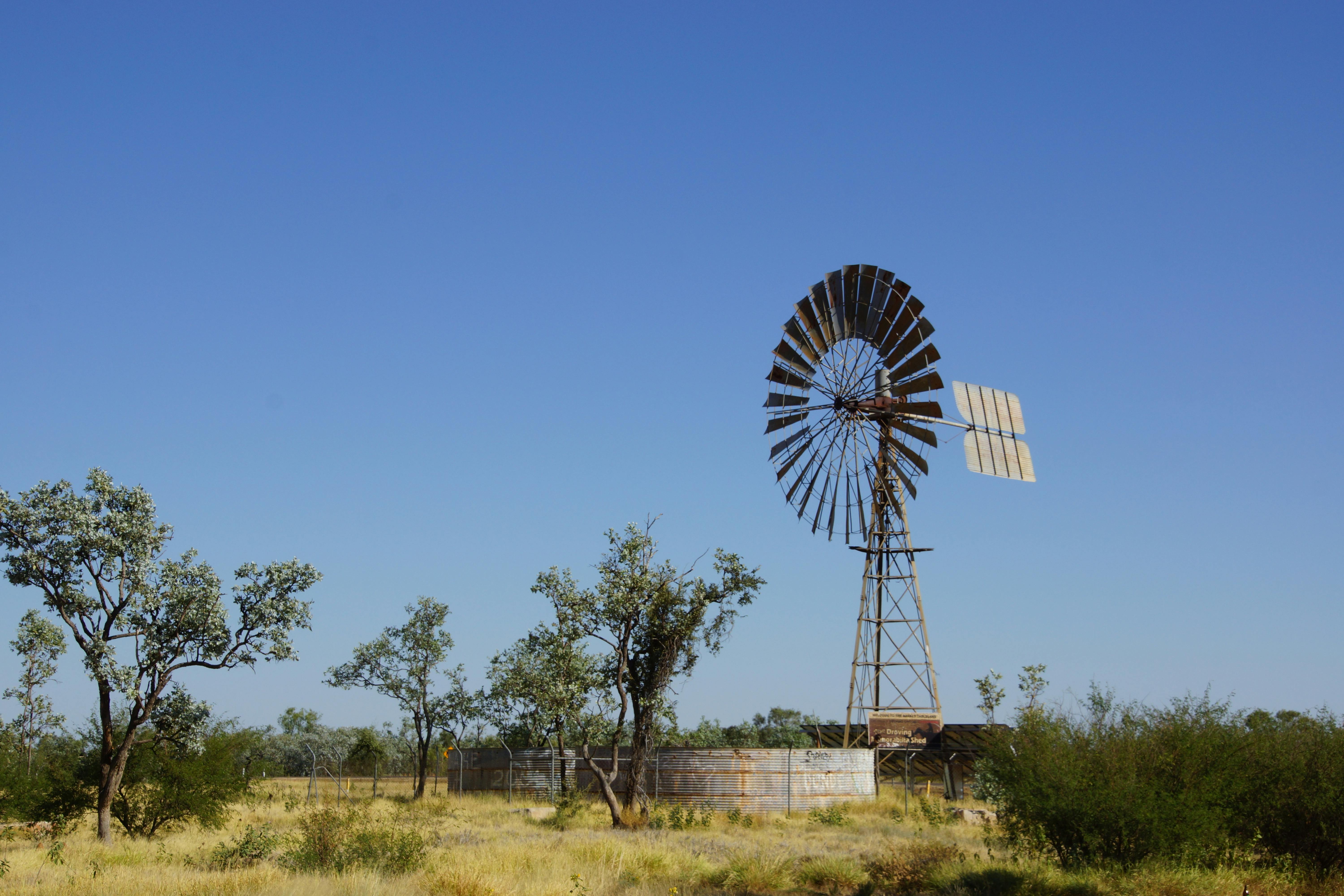Windmill on Field under Blue Sky · Free Stock Photo