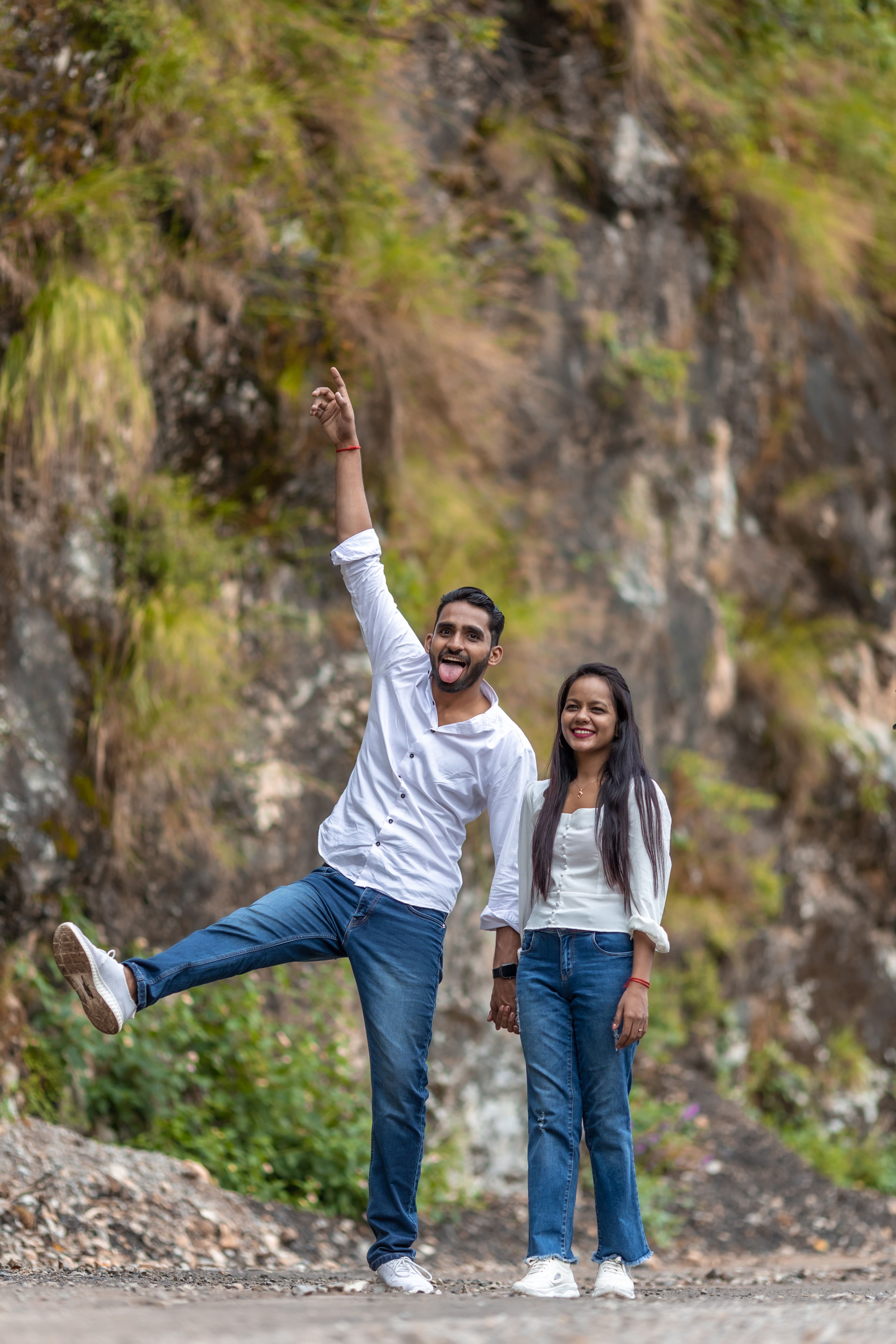 Funny Man Standing on Road Beside Woman · Free Stock Photo