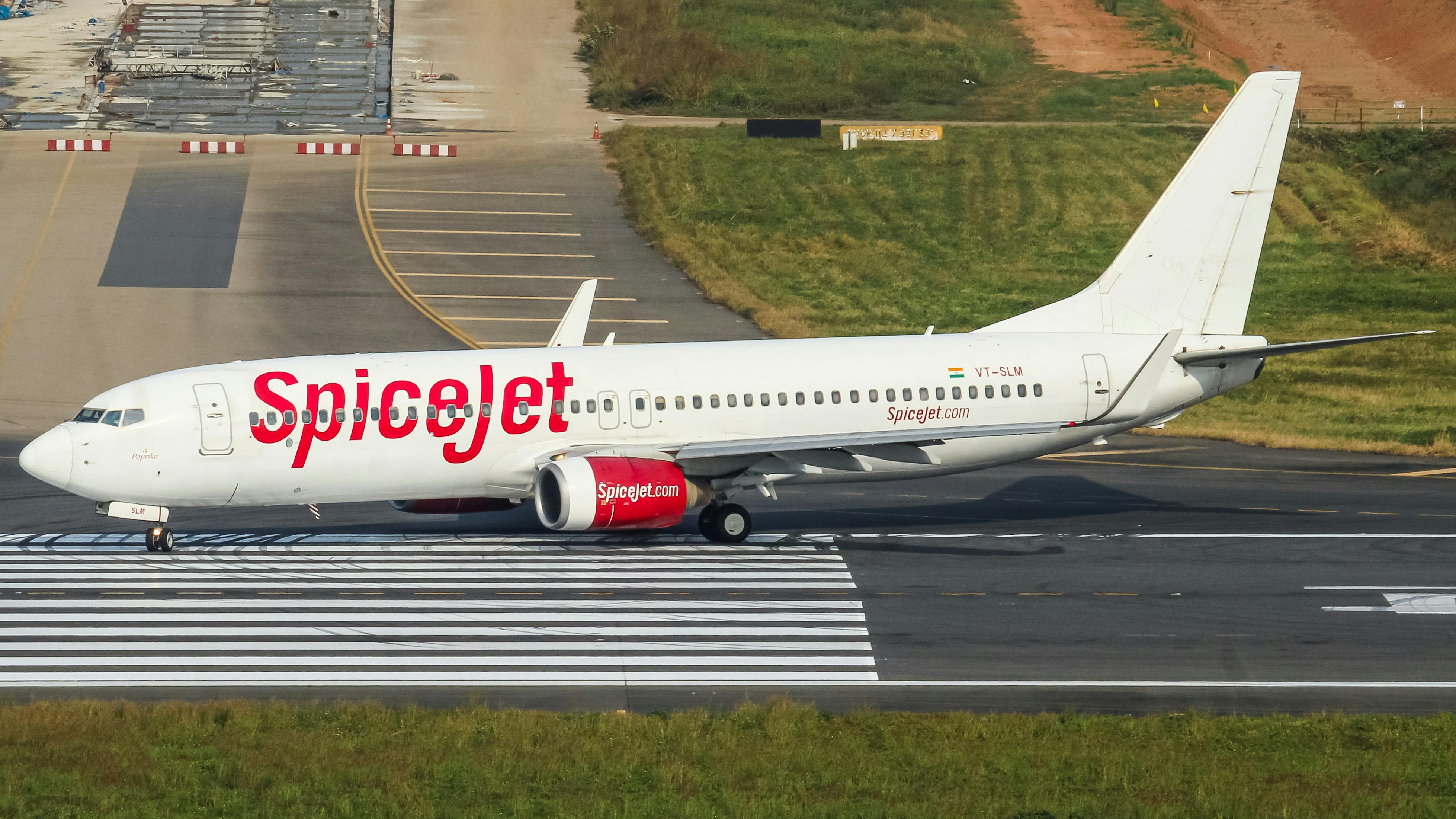 SpiceJet Airplane on an Airport Runway · Free Stock Photo