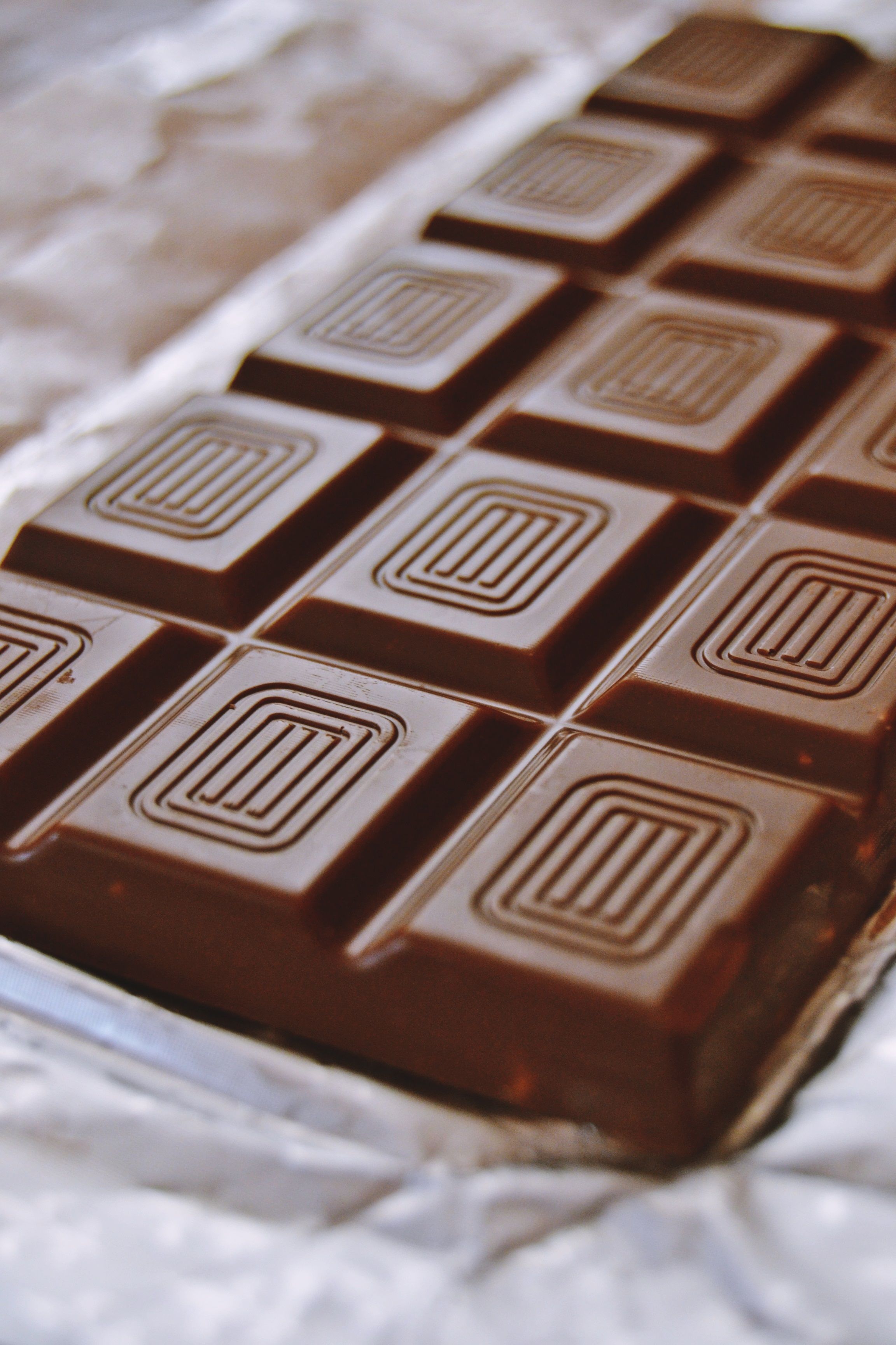 Chocolate Bars on Beige Background · Free Stock Photo