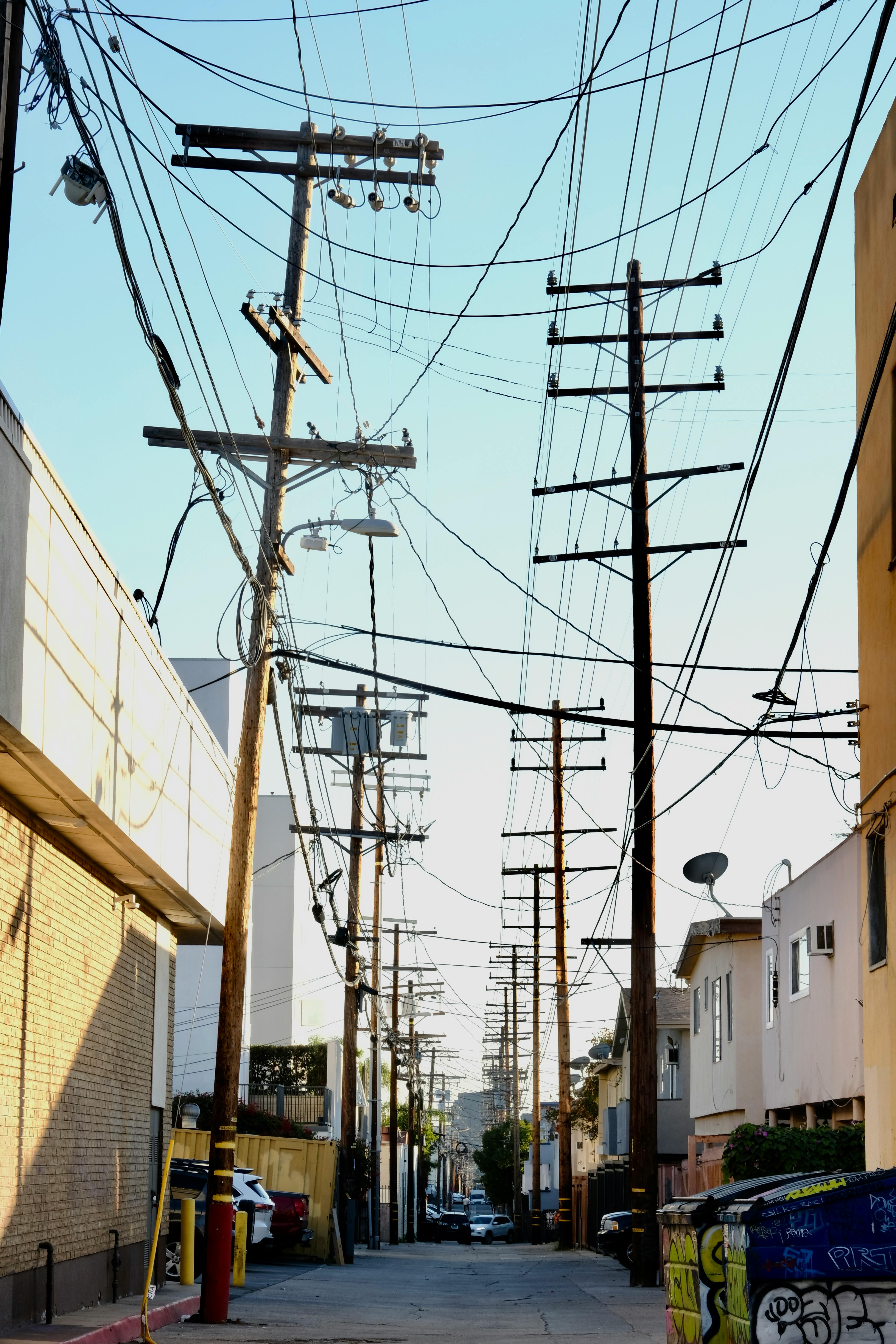 Power Line Poles in an Alley · Free Stock Photo