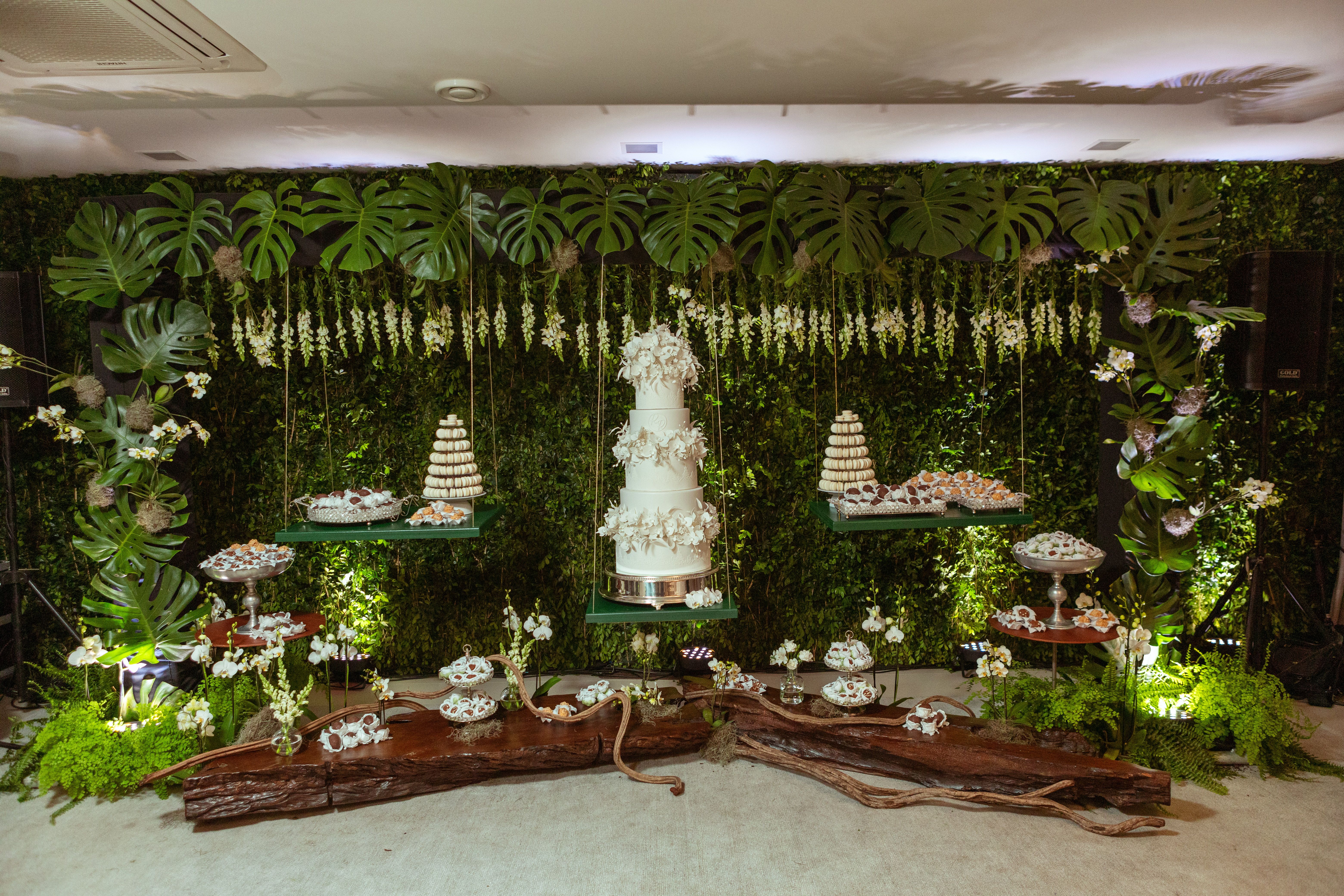 Buffet with a Layer Cake and Sweets Decorated with Tropical Flowers ...