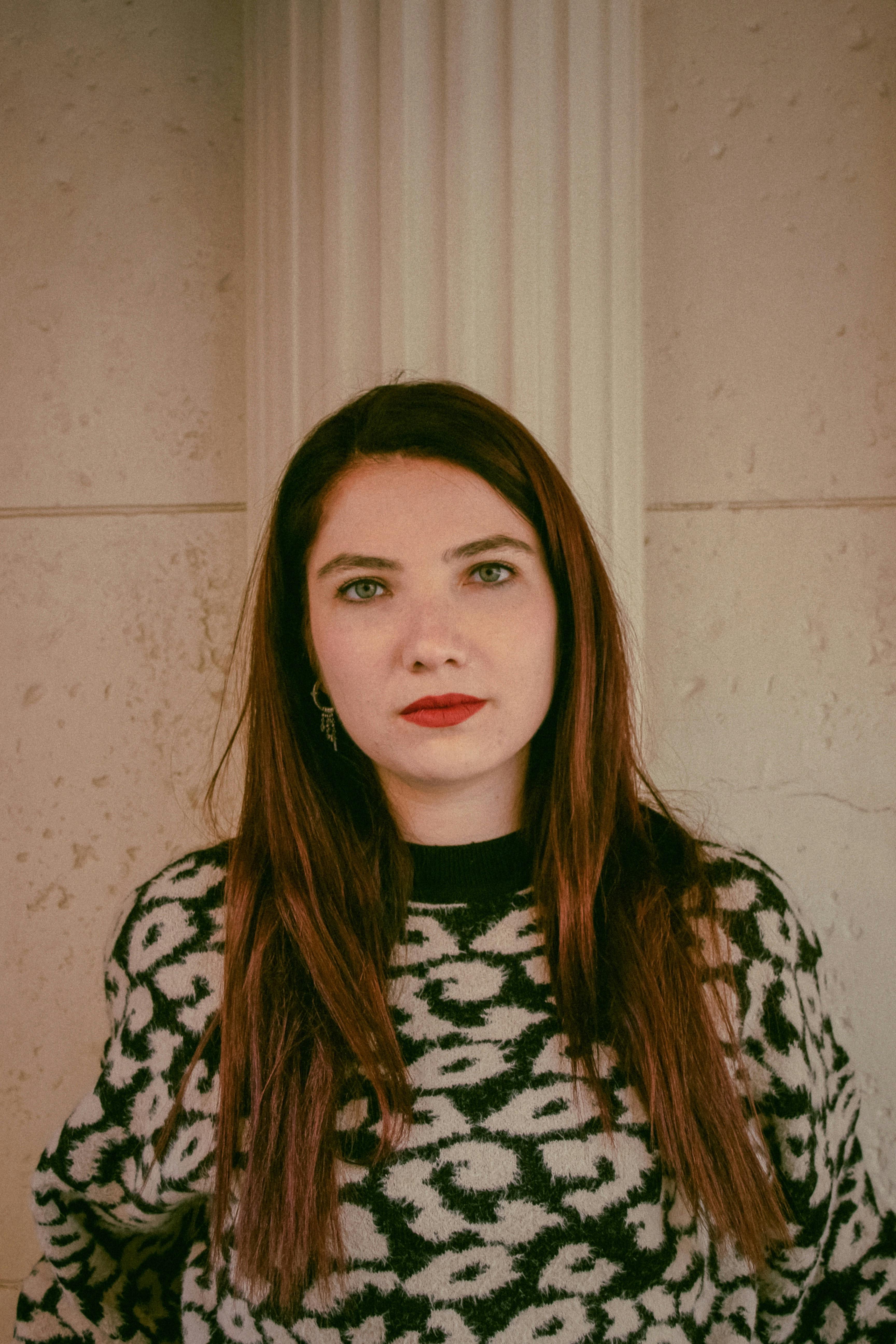 A Woman Wearing Leopard Print Long Sleeves · Free Stock Photo