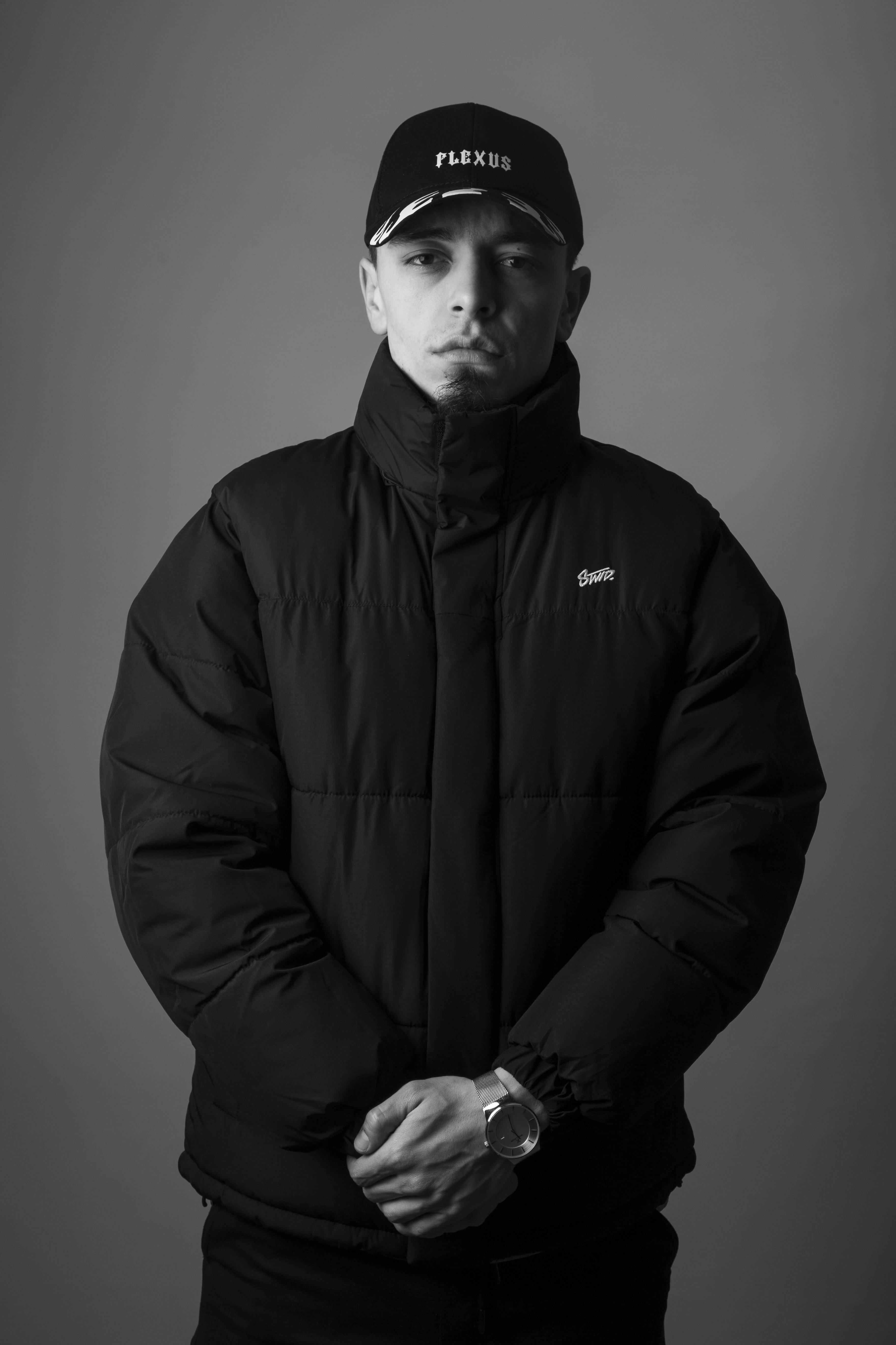 Black and White Photo of a Man Wearing Jacket and Hat · Free Stock Photo