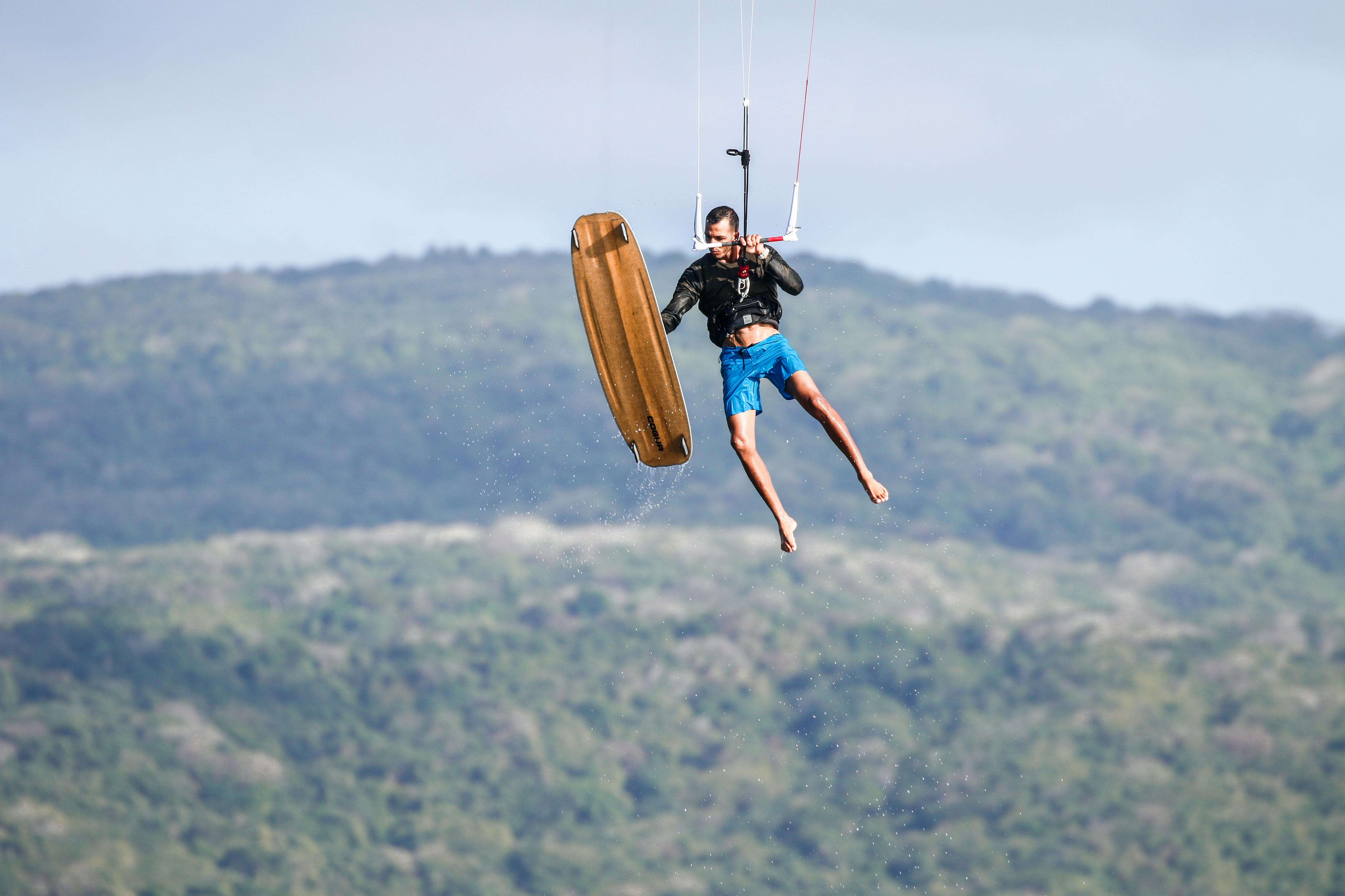 Man Parachuting in Sky in Mountains · Free Stock Photo