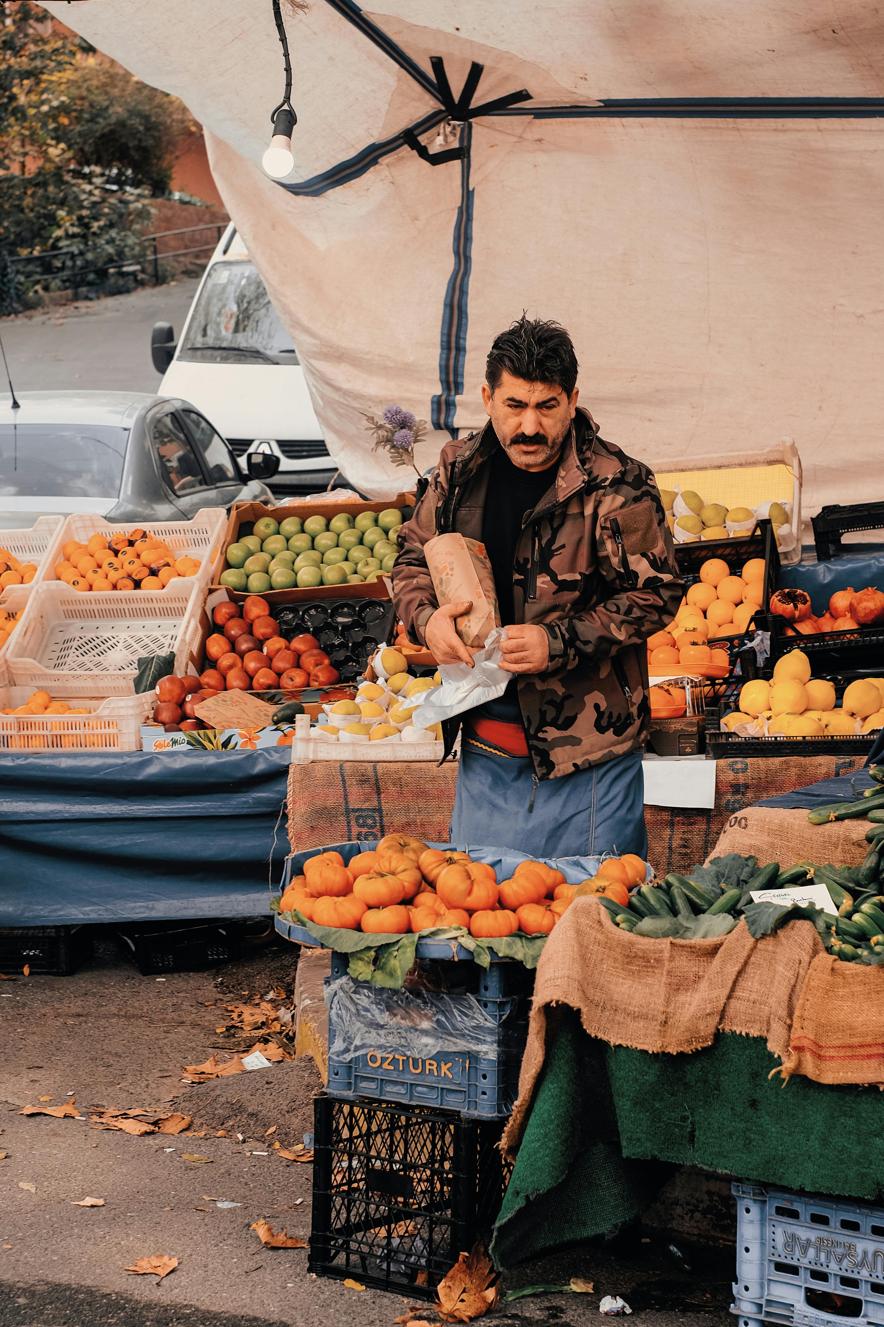 Man Selling Fruit and Vegetables on Outdoor Market · Free Stock Photo