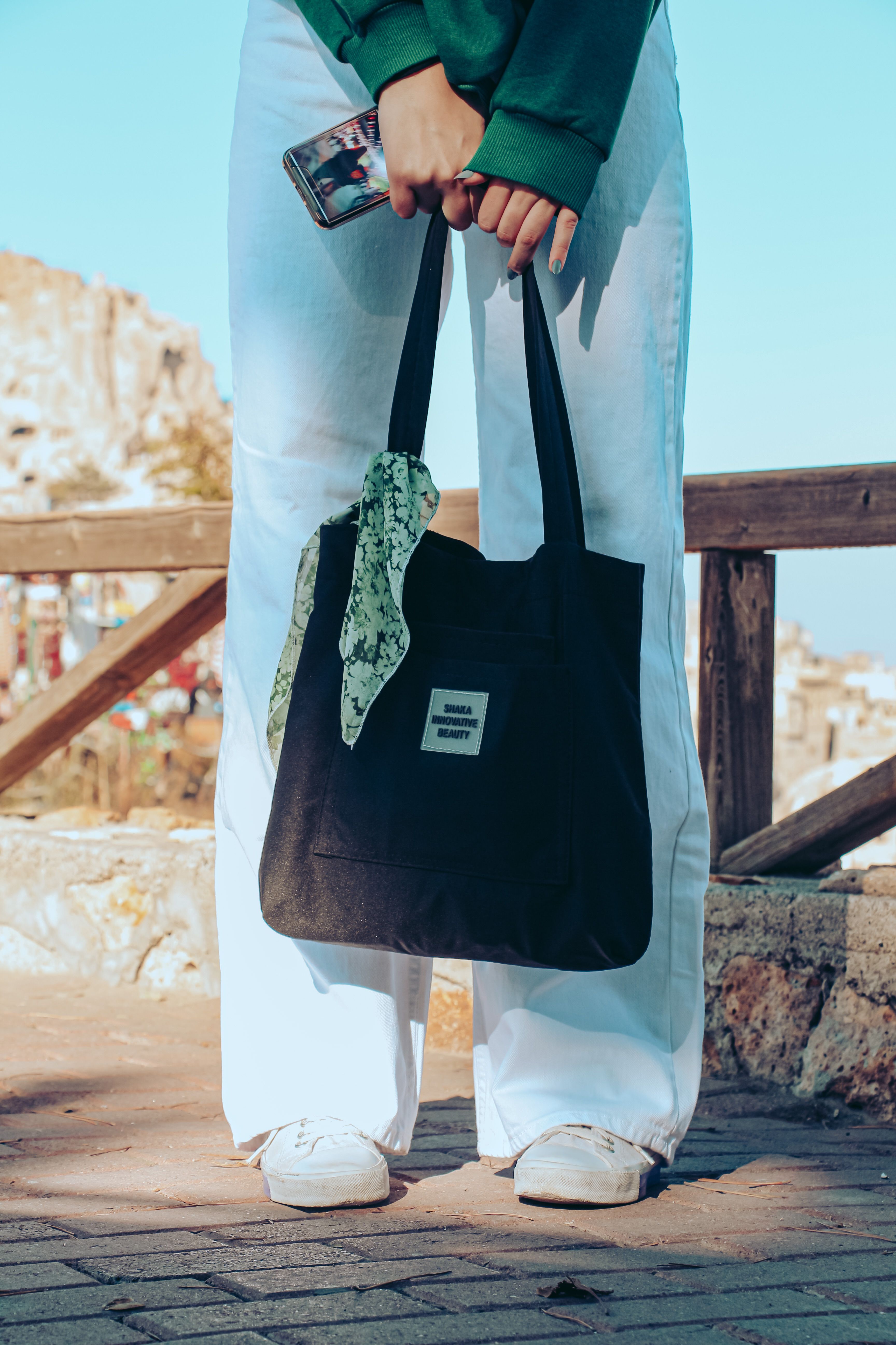 Close-Up Shot of a Person Holding a Black Tote Bag · Free Stock Photo