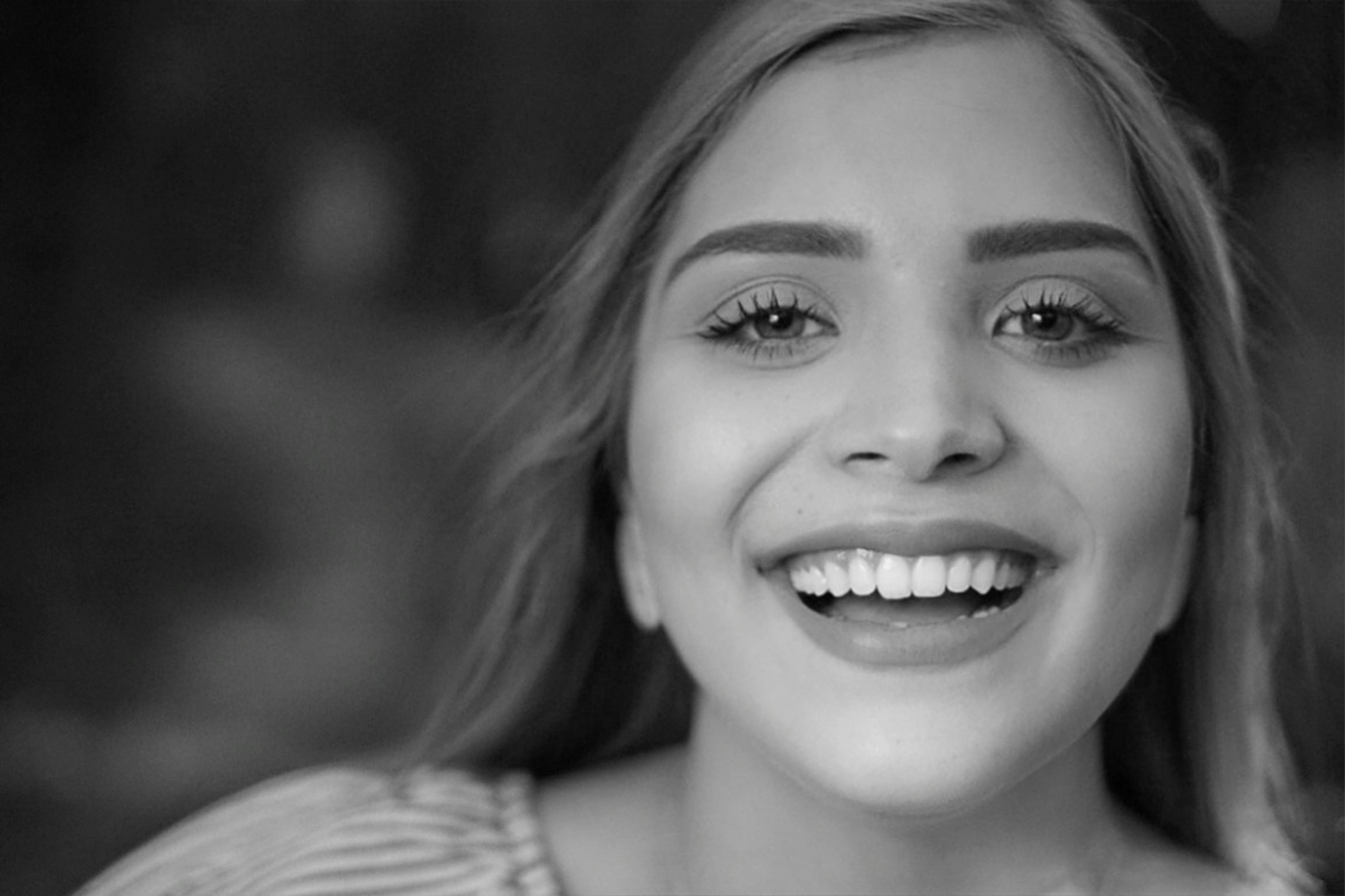 Grayscale Photo of Smiling Woman · Free Stock Photo
