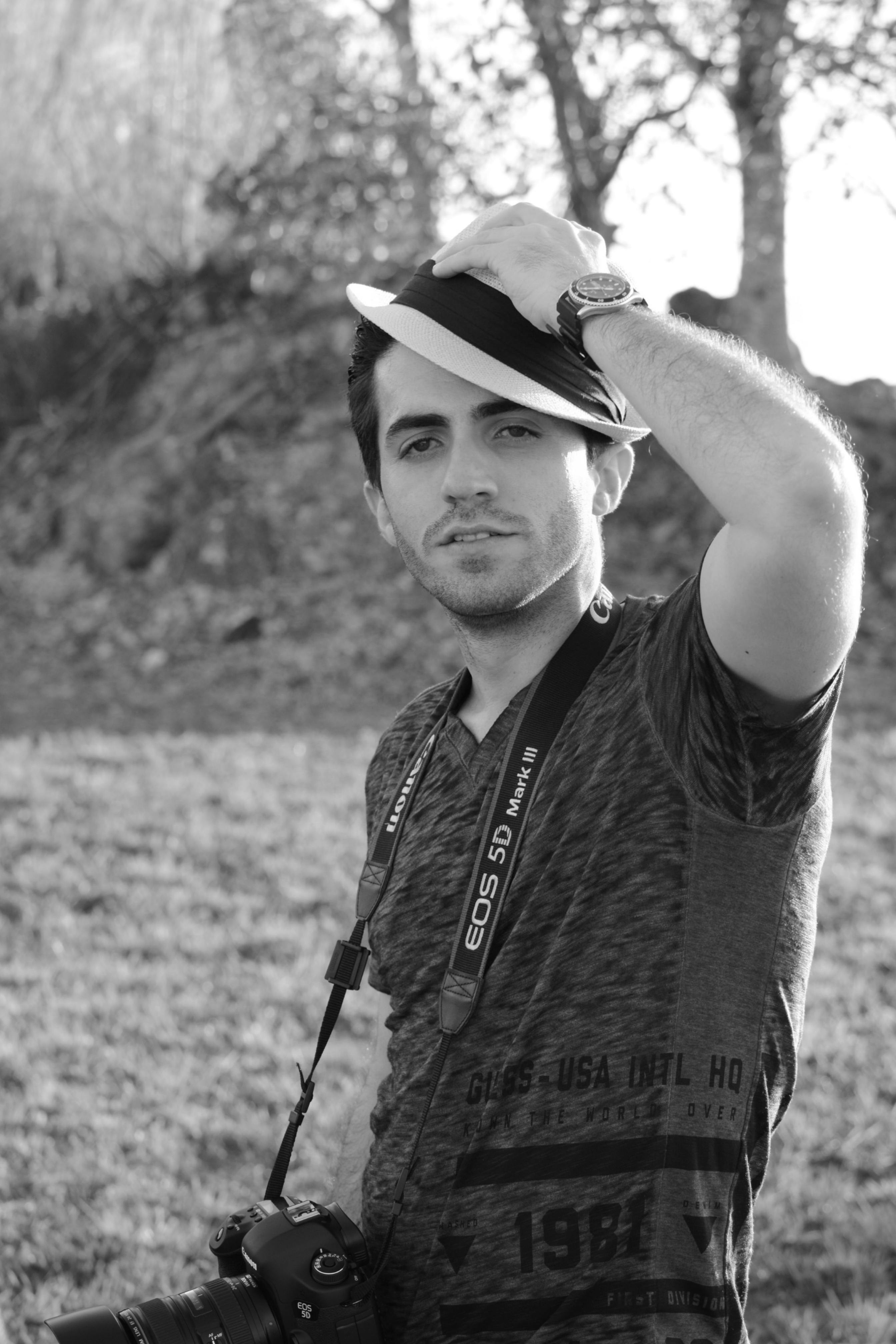 Man in a Hat with a Camera · Free Stock Photo