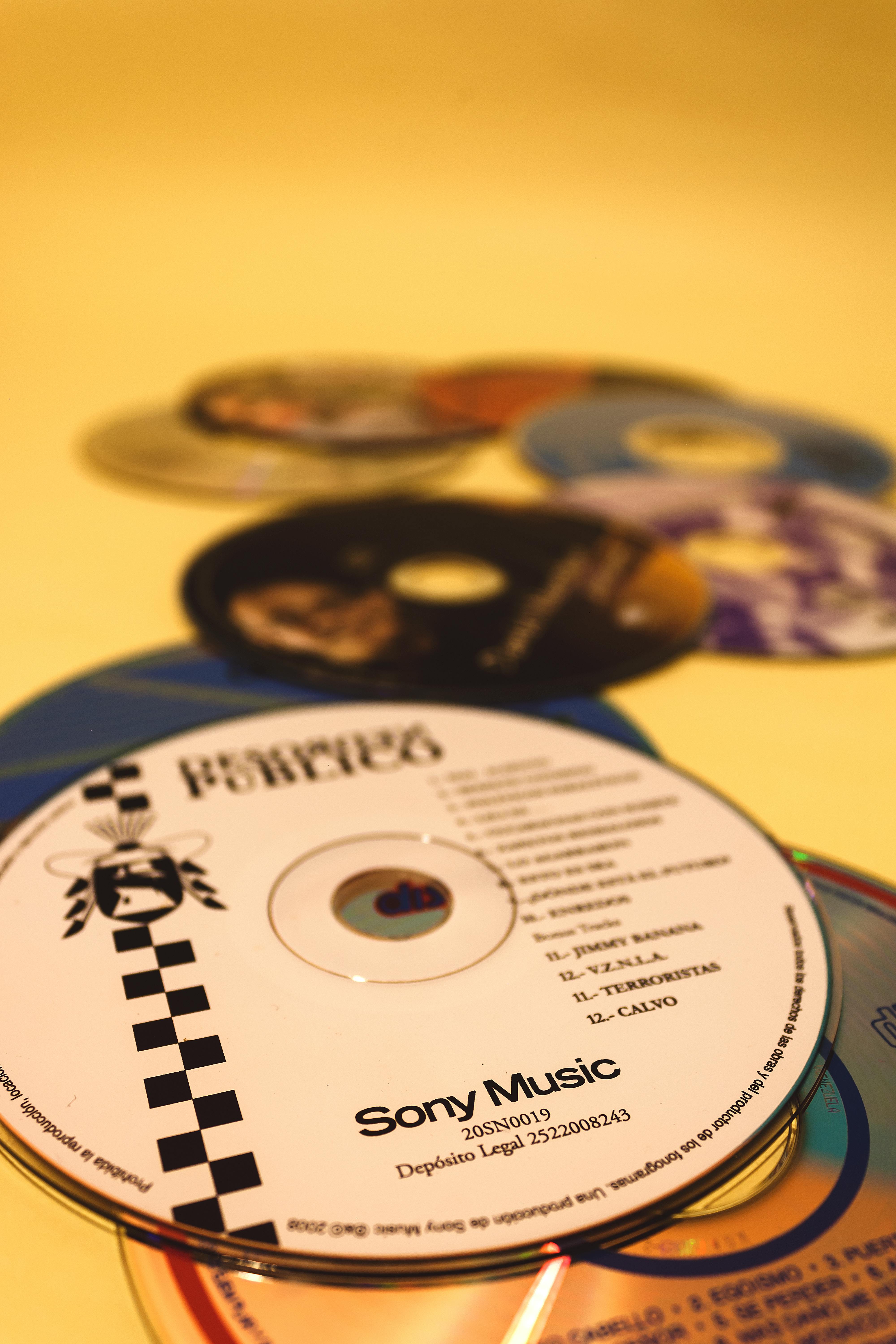 Close-Up Photo of Person Holding a Compact Disc · Free Stock Photo