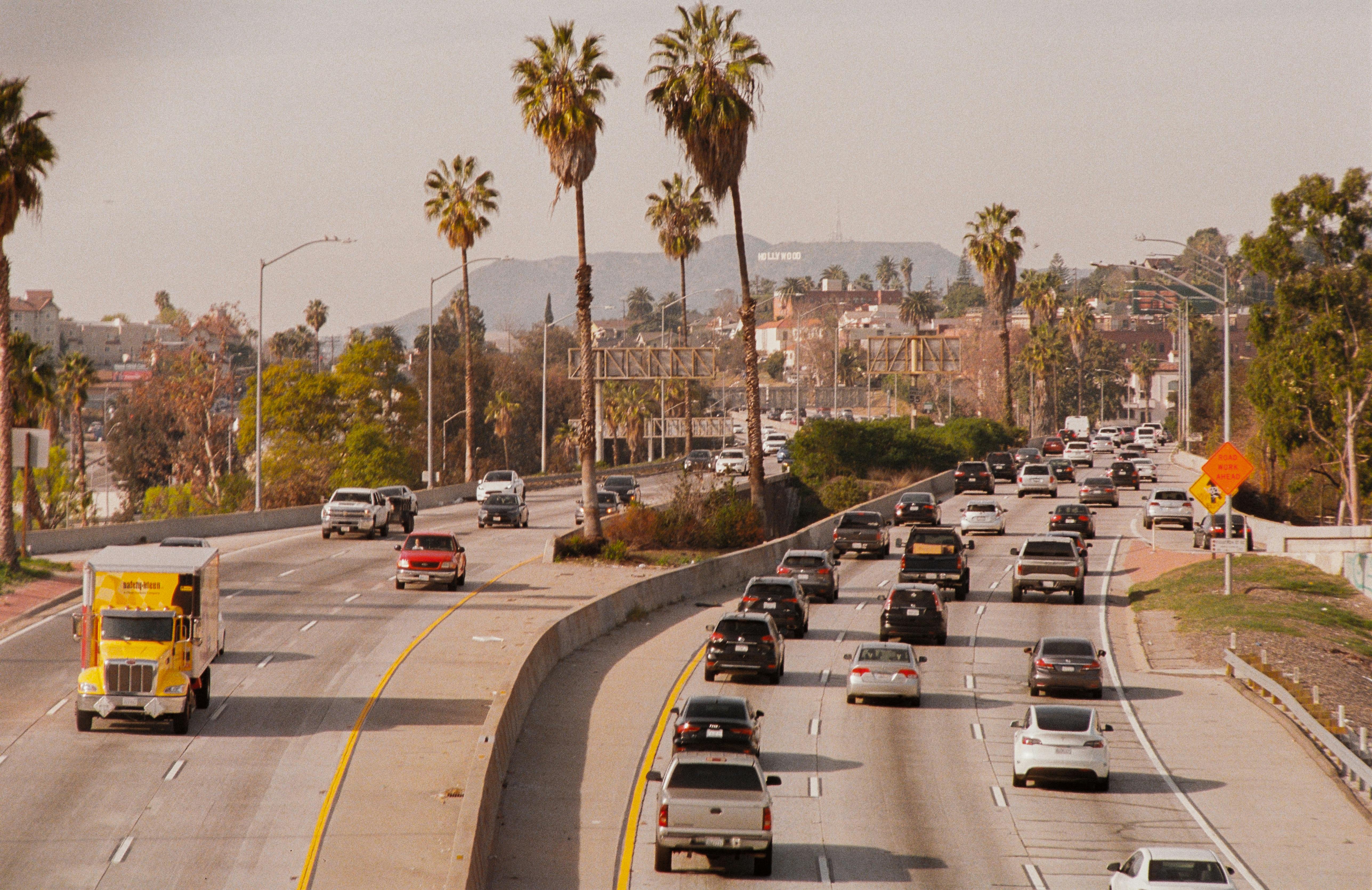 Cars Parked Beside the Road Near the Building · Free Stock Photo