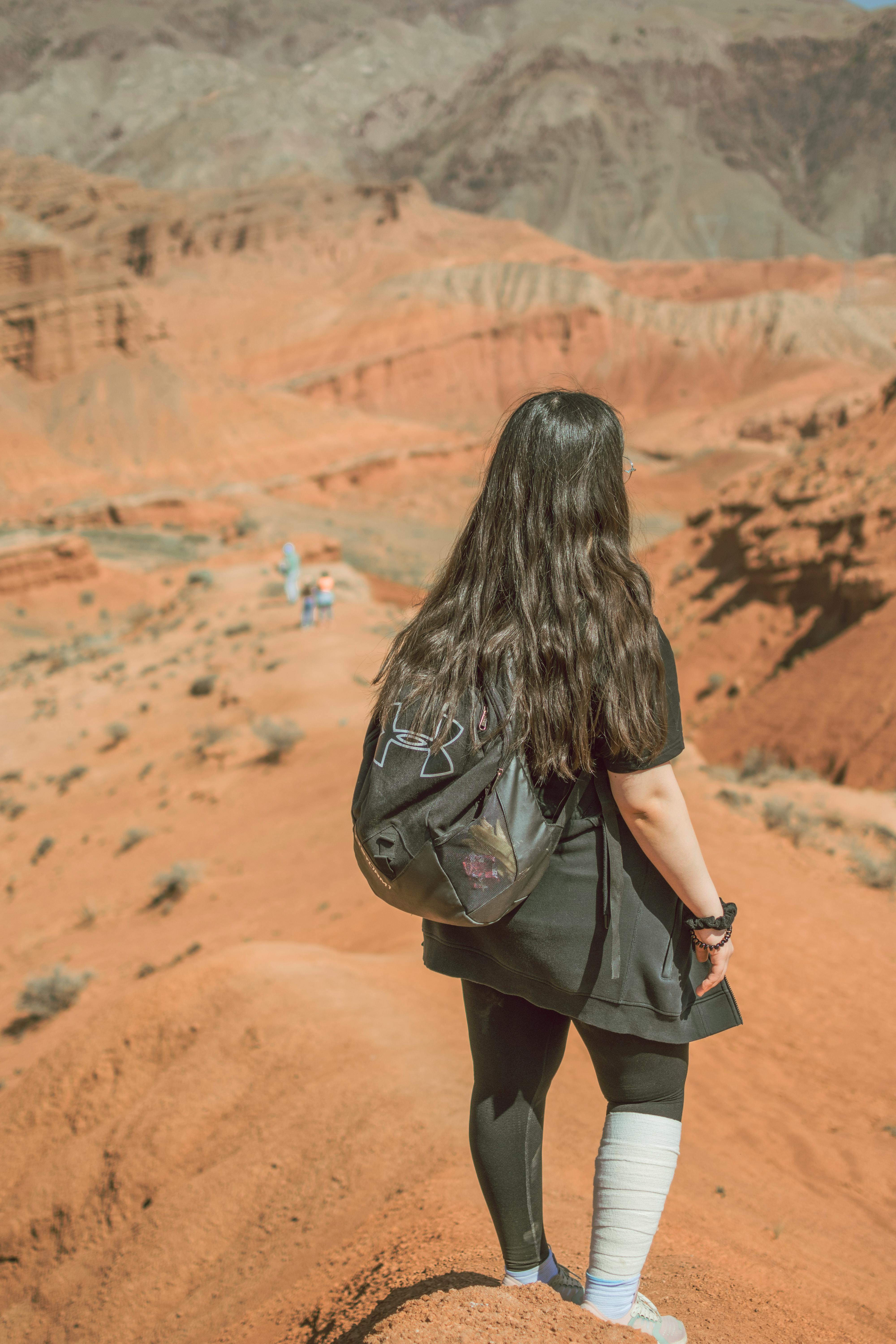 Black and White Photo of Man Wearing Backpack · Free Stock Photo