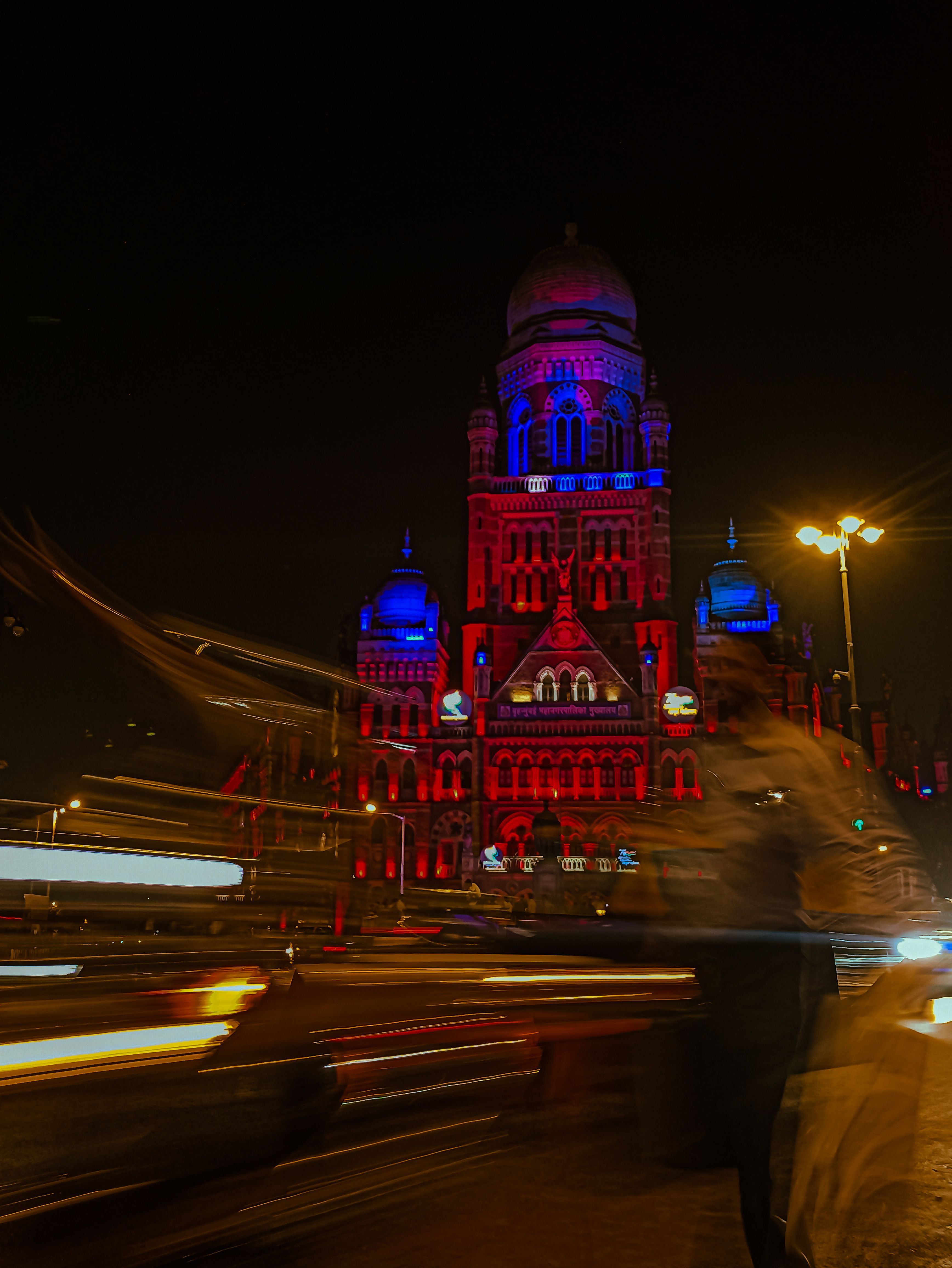 Gothic styled aged building in illuminated city at night · Free Stock Photo