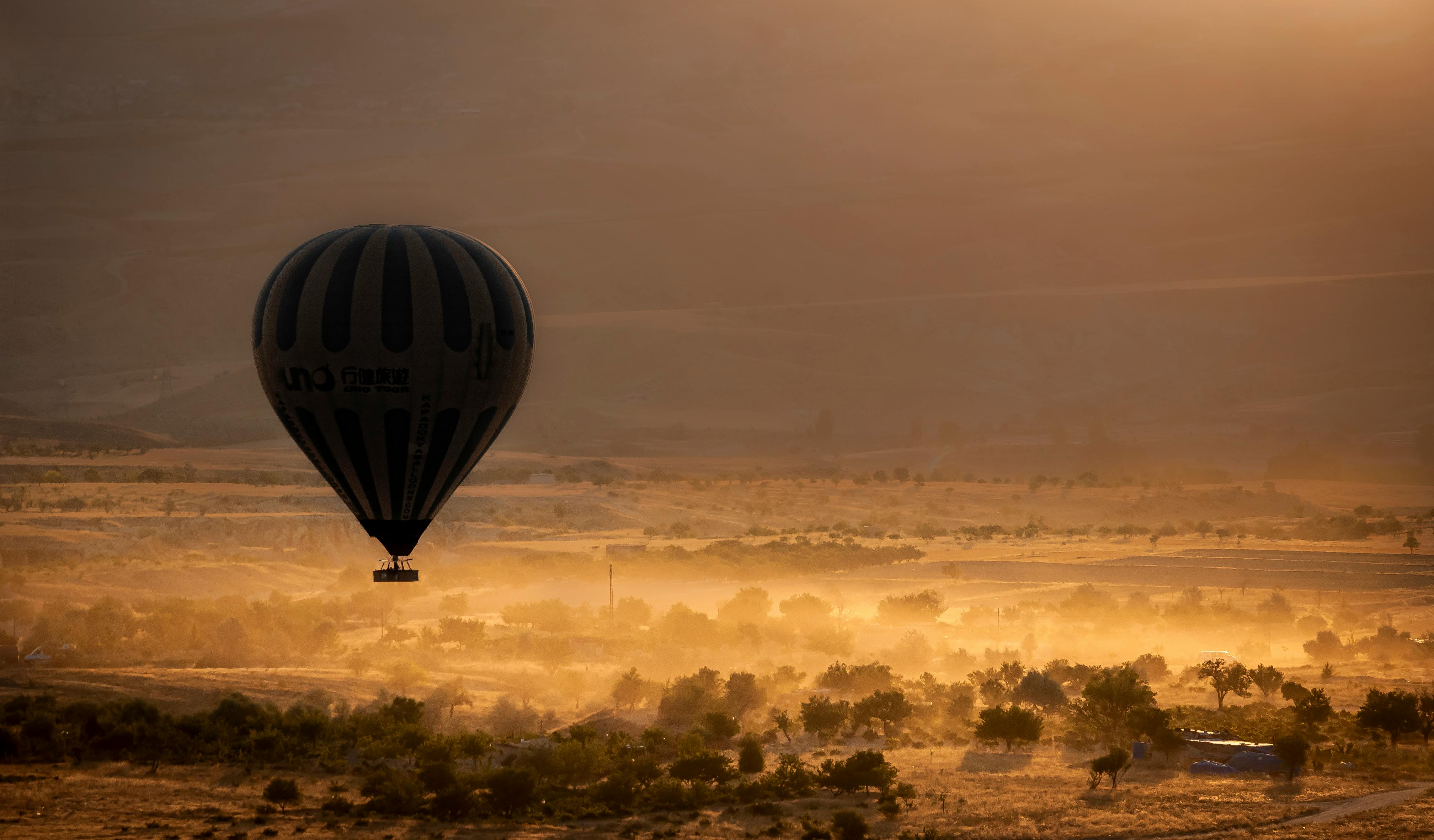A Hot Air Balloon Flying during Sunset · Free Stock Photo