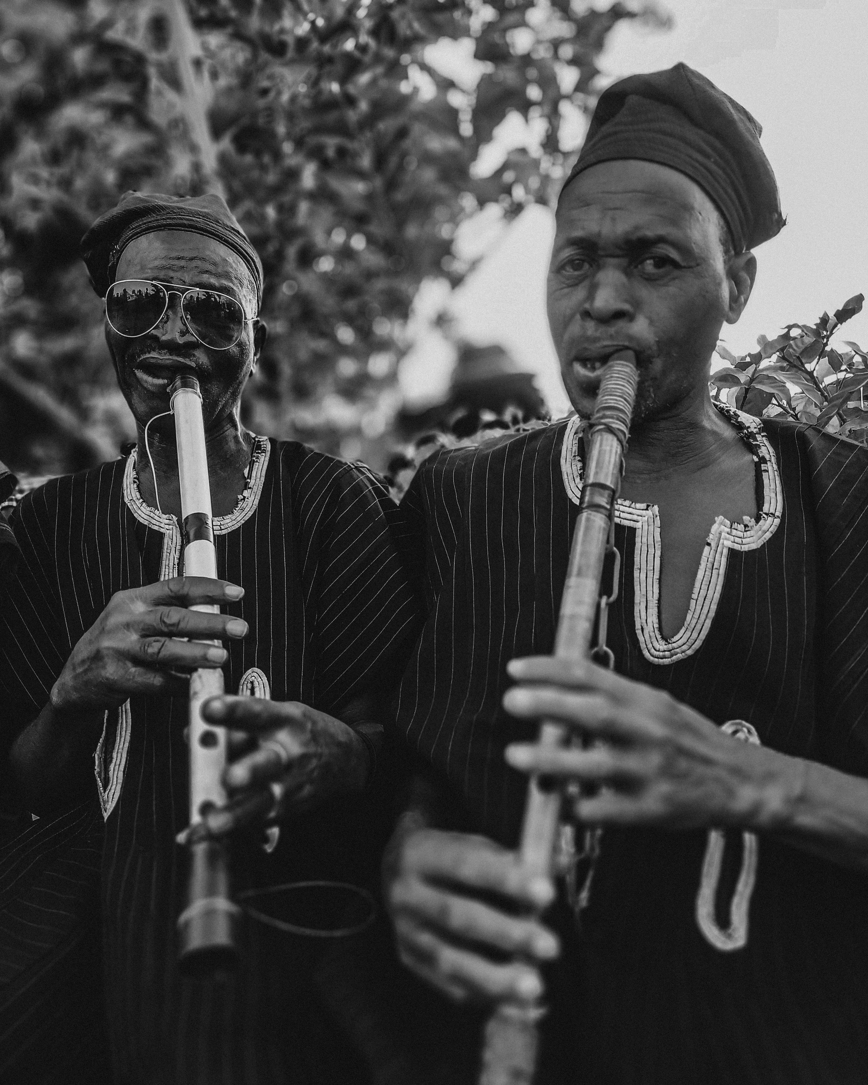Grayscale Photo of Men Playing Flute · Free Stock Photo
