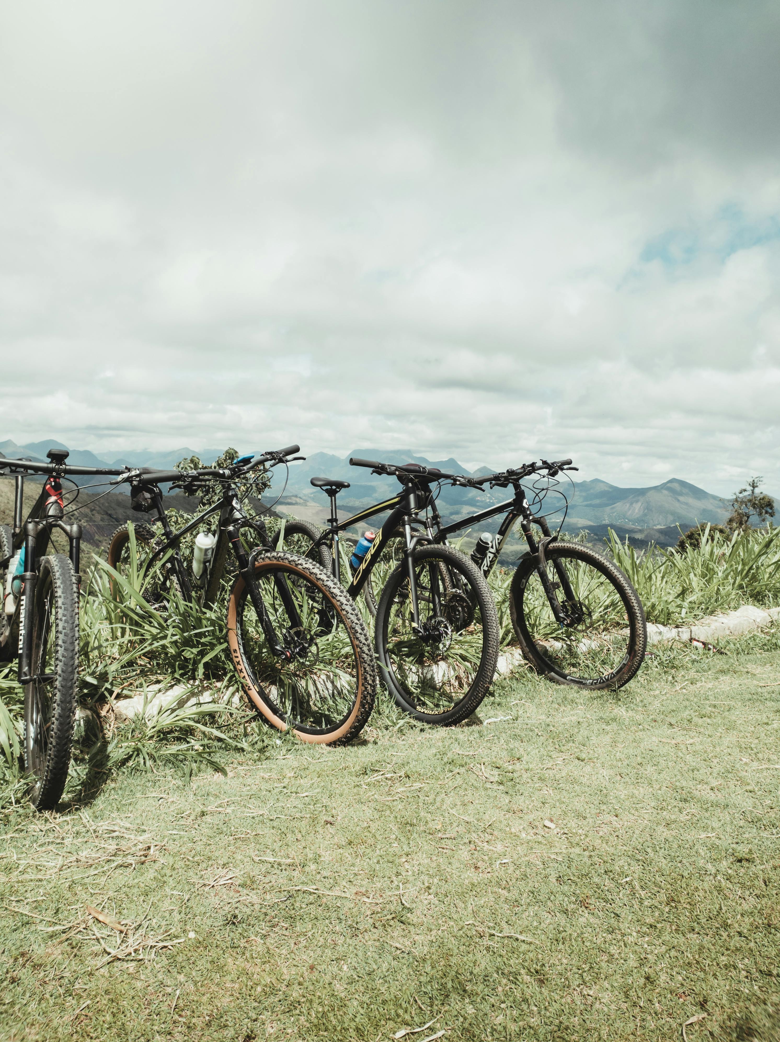 A Bicycles Parked on Green Grass Field · Free Stock Photo