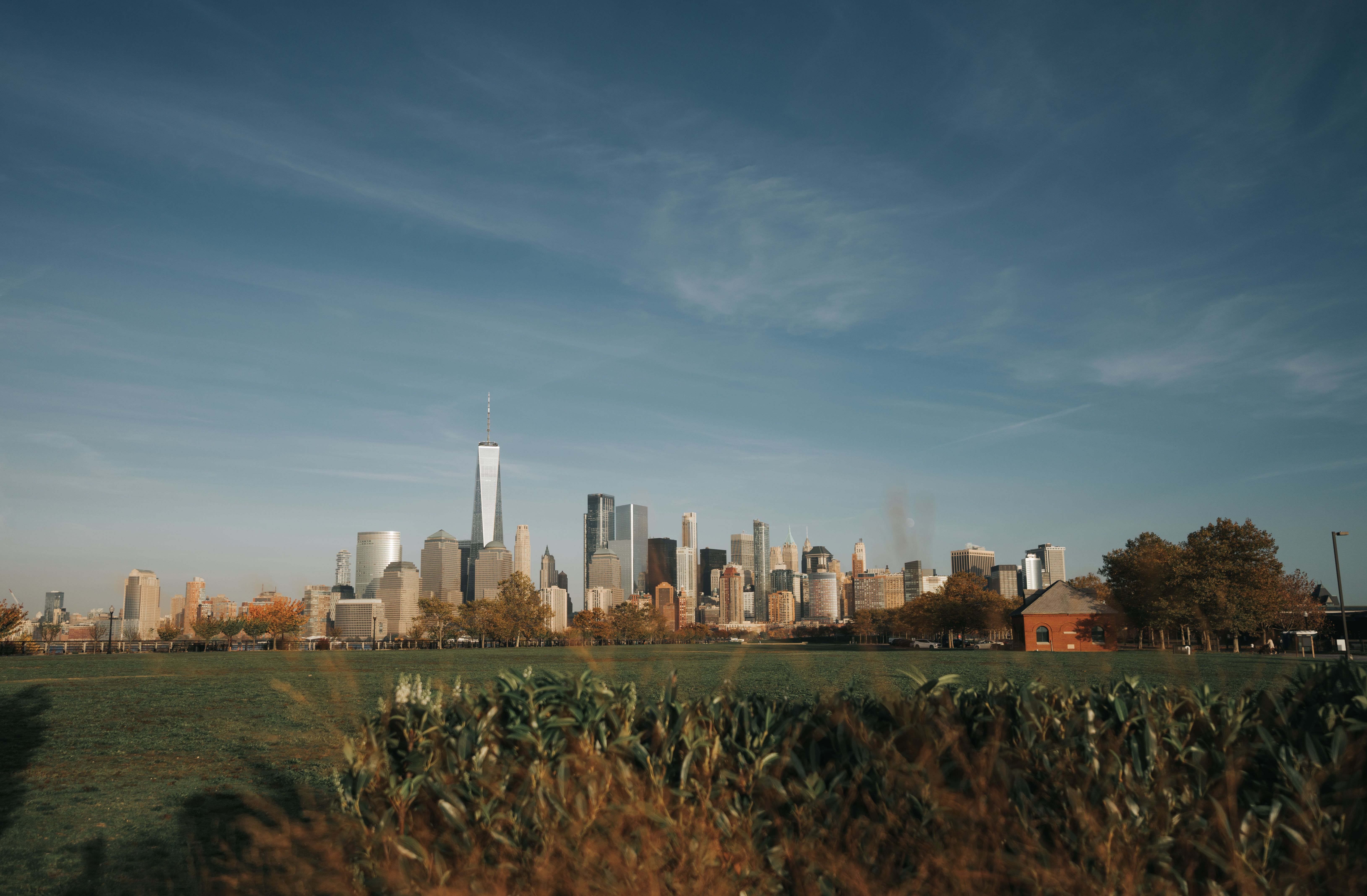 Airplane Flying over City Skyline · Free Stock Photo